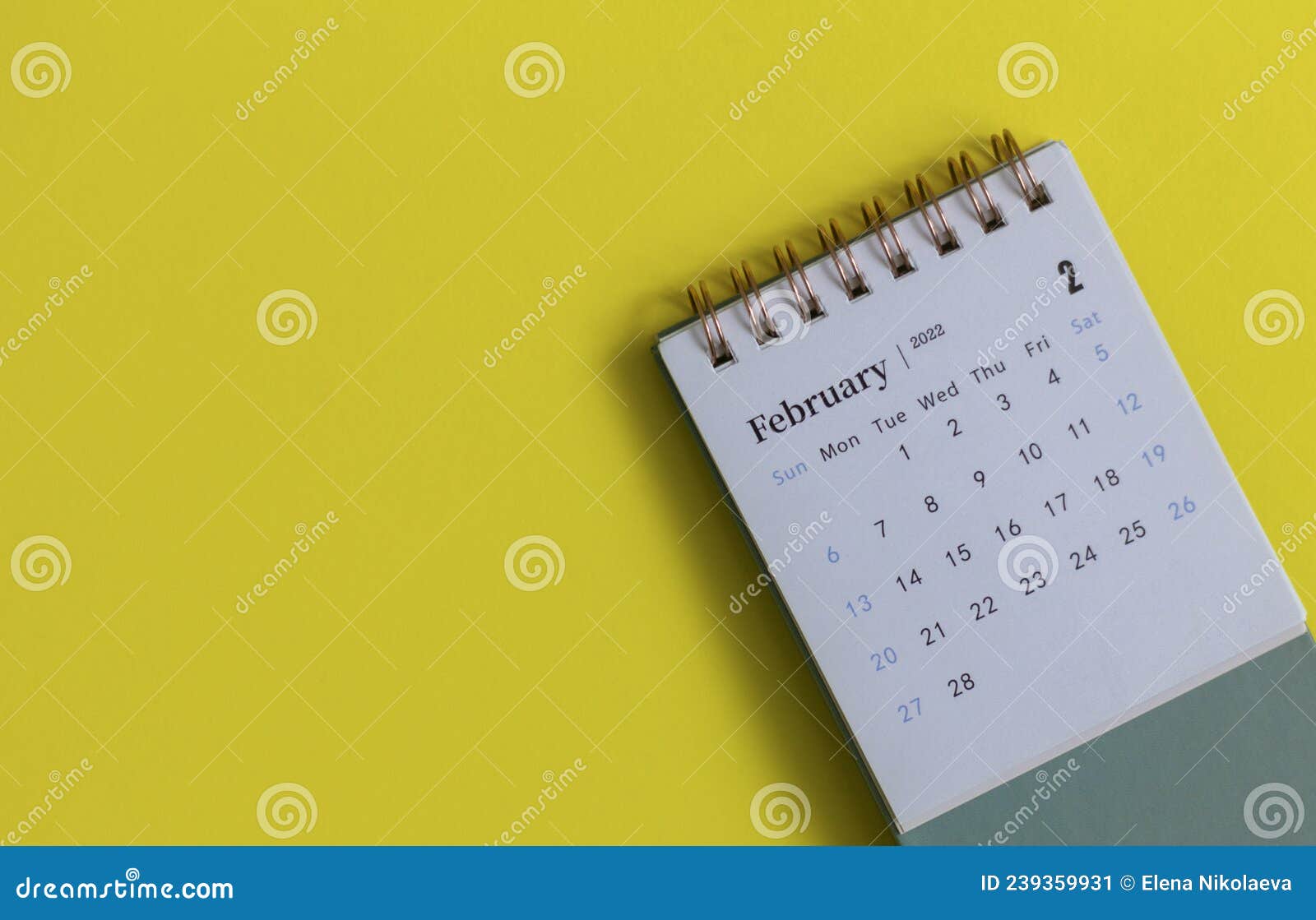 Desktop Calendar for February 2022 on a Yellow Background Stock Image ...
