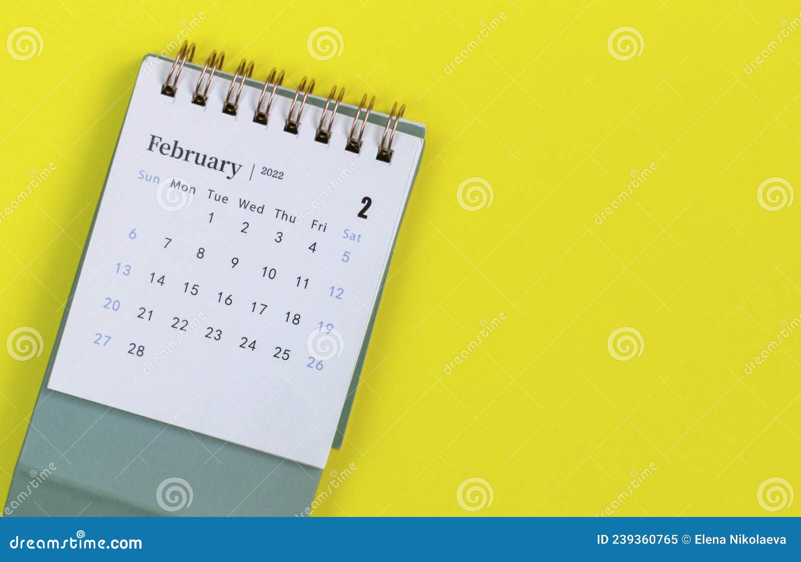 Desktop Calendar for February 2022 on a Yellow Background Stock Image ...