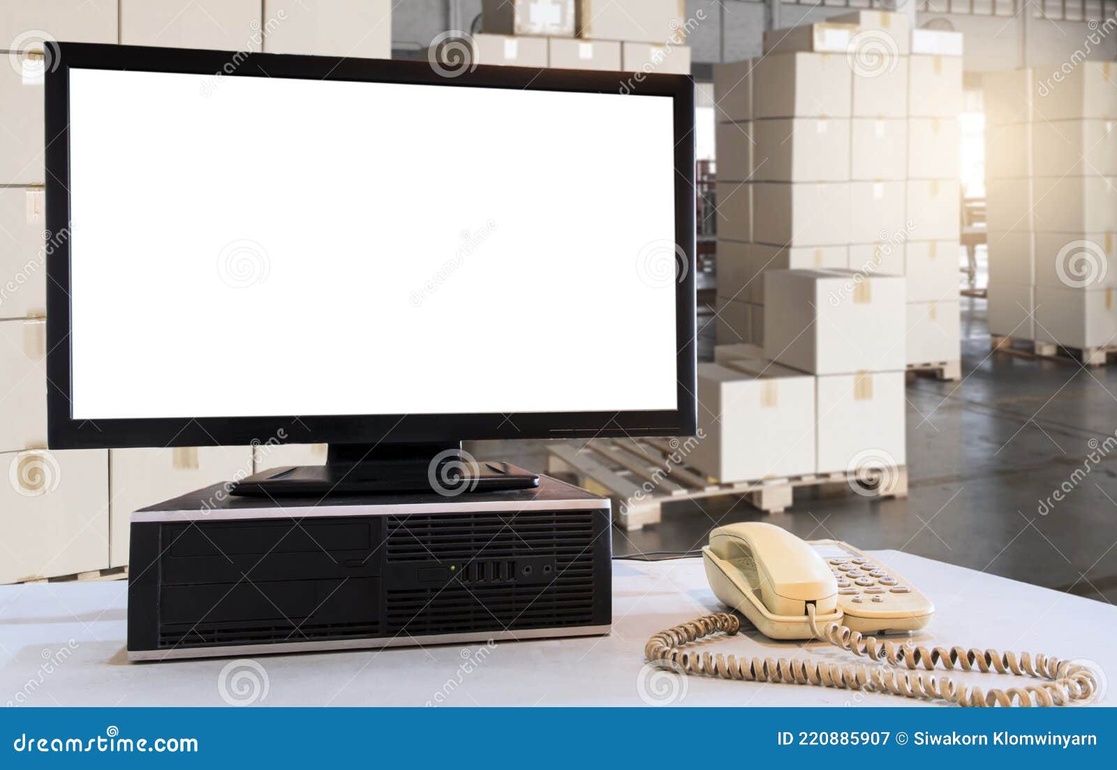 Desktop Computer Blank Screen and Stack of Cardboard Boxes in ...