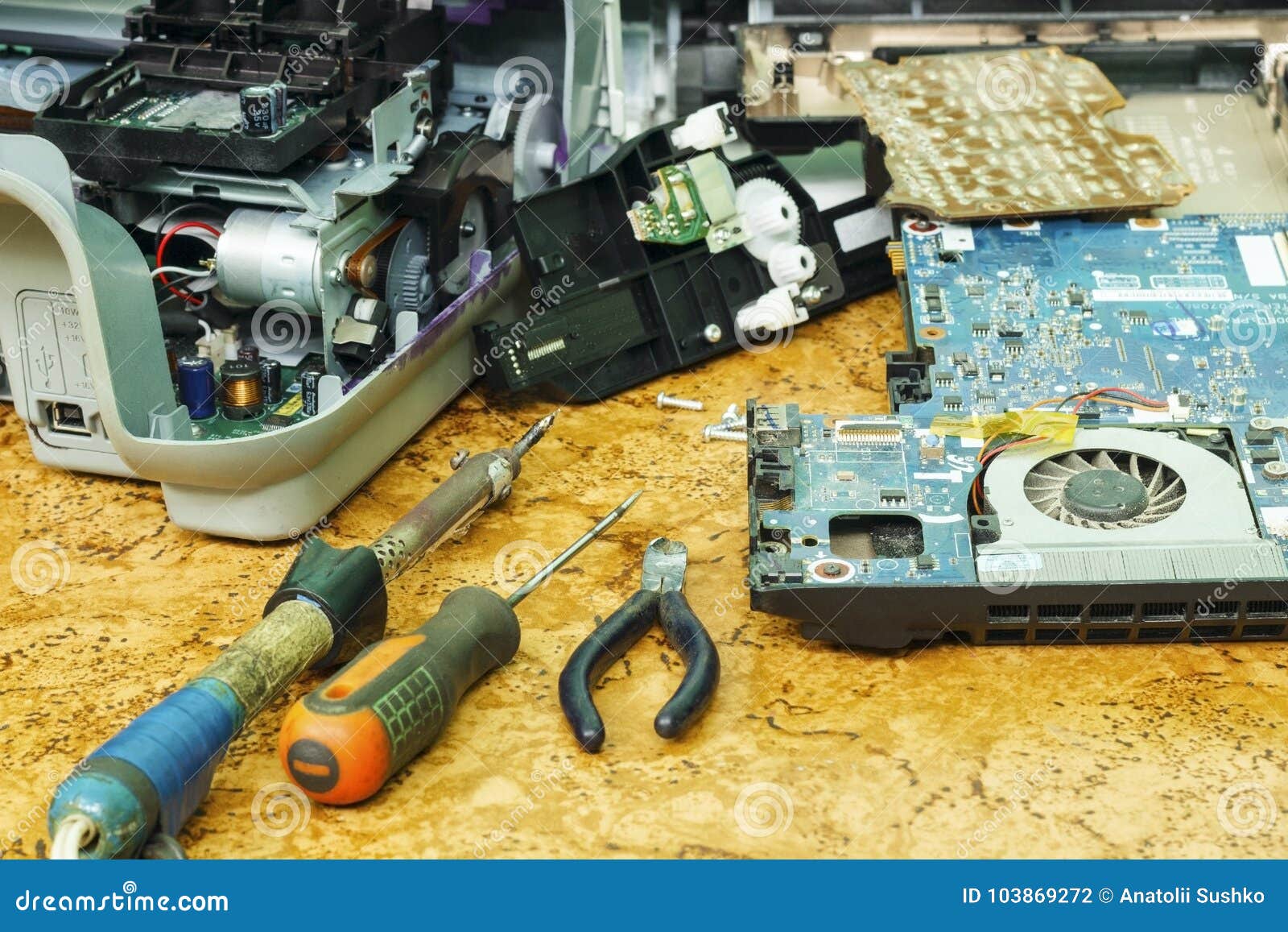 On the Desktop is Disassembled Equipment and Tools for Repair. Stock ...