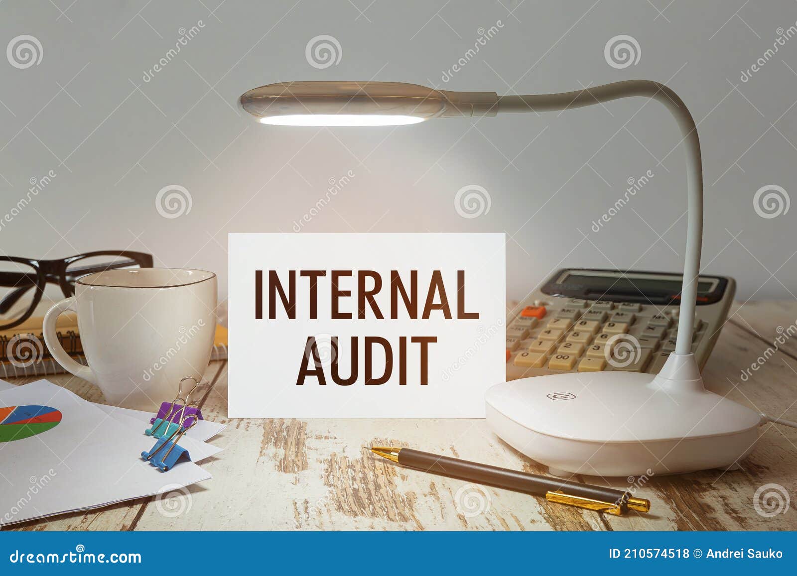 Desktop with a Lamp that Illuminates the Inscription INTERNAL AUDIT ...