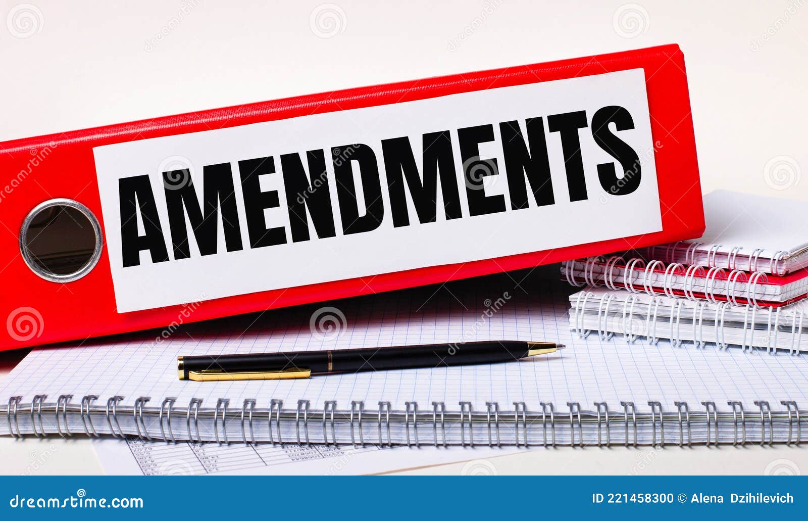 On the Desktop are Notebooks, a Pen and a Red Folder for Papers with ...