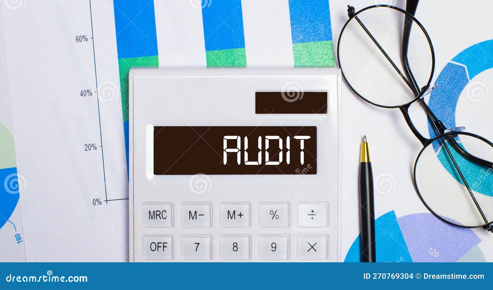 On the Desktop are Reports, a Pen, Glasses and a White Calculator with ...