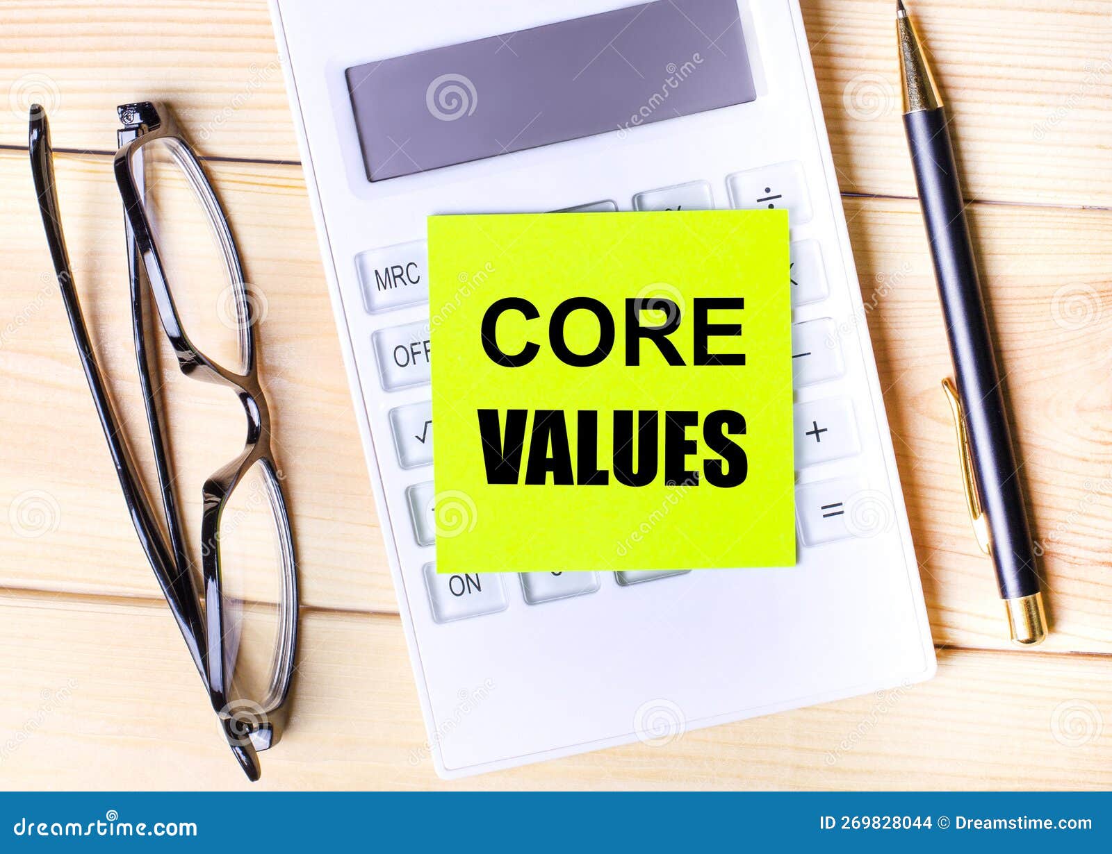 On the Desktop There is a Green Sticker with the Text CORE VALUES, a ...