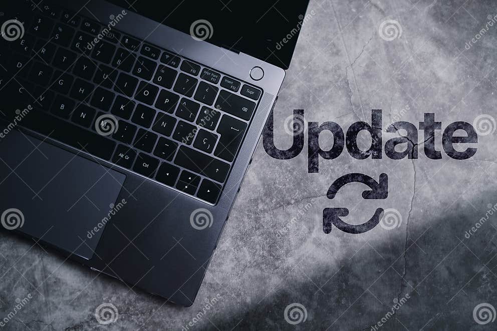 Desktop Top View with Laptop and the Word Update Written on Surface ...