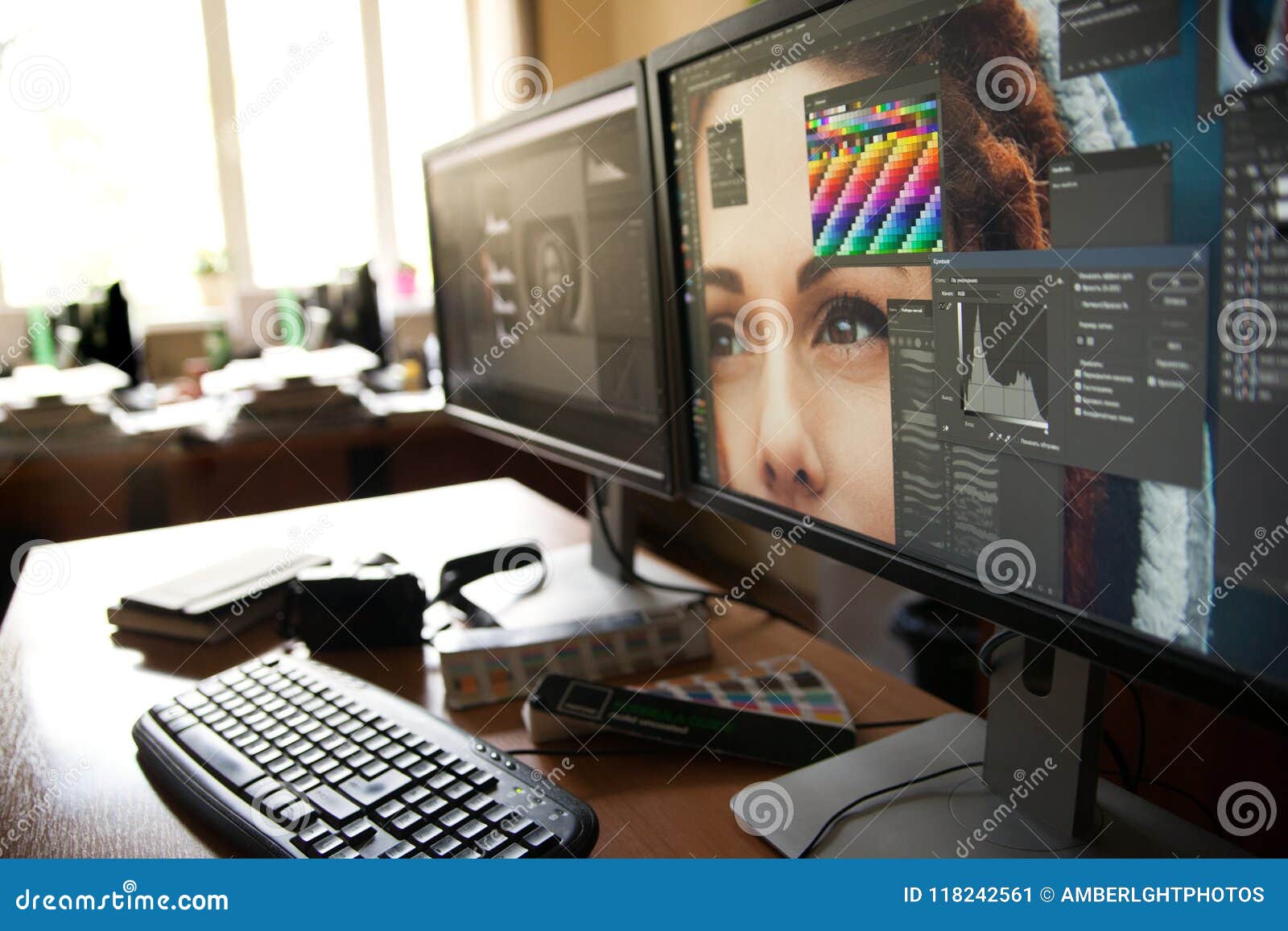 Desktop with Two Monitors, a Keyboard, a Camera, a Diary, a Palette for ...