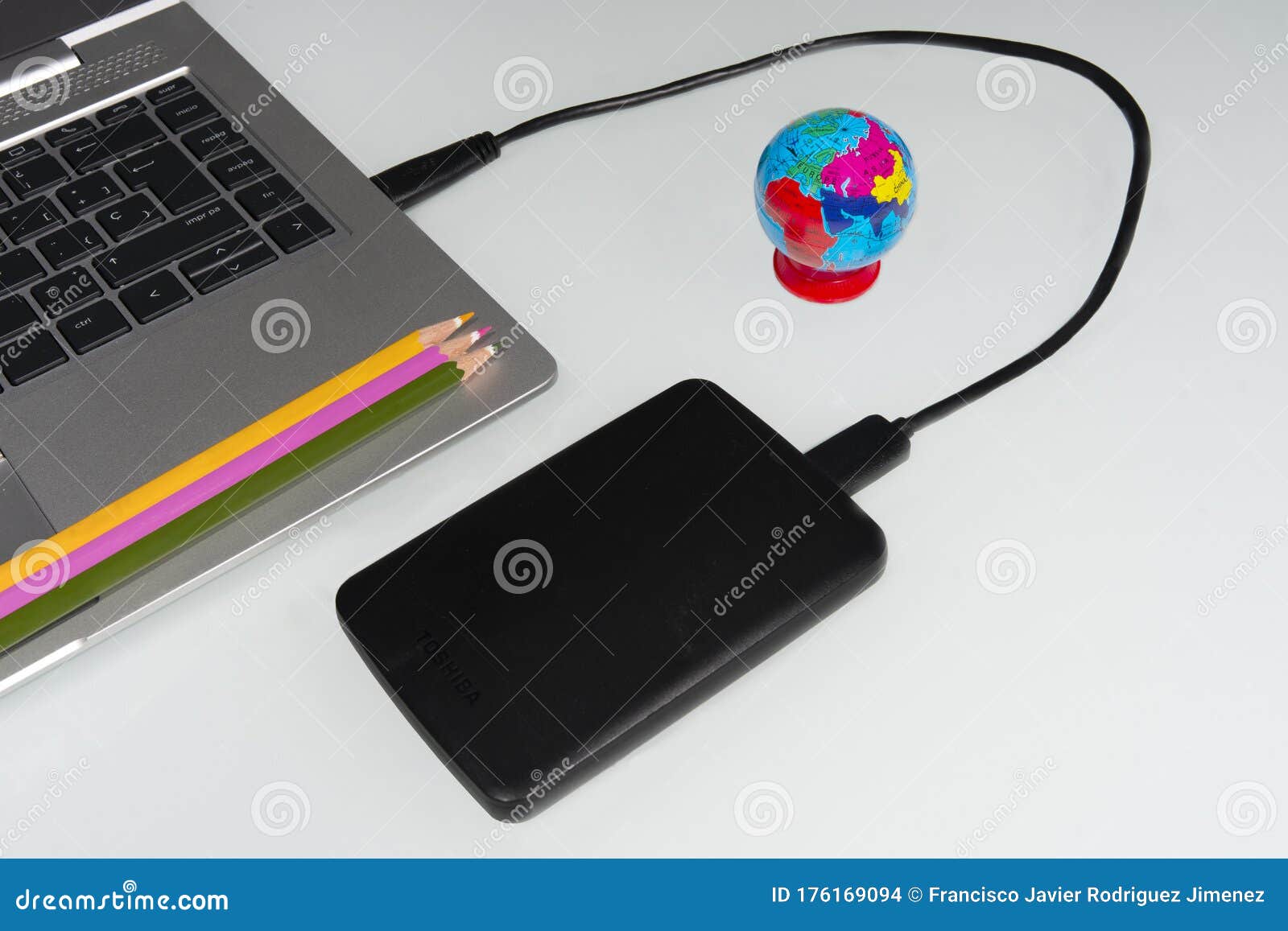 Desktop with World and Hard Drive Connected To a Computer through the ...