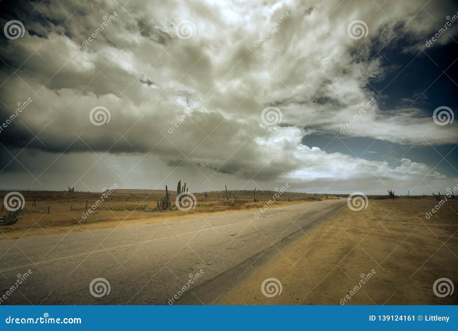 Desolate Desert Road with Dramatic Clouds in Sky Stock Image - Image of ...