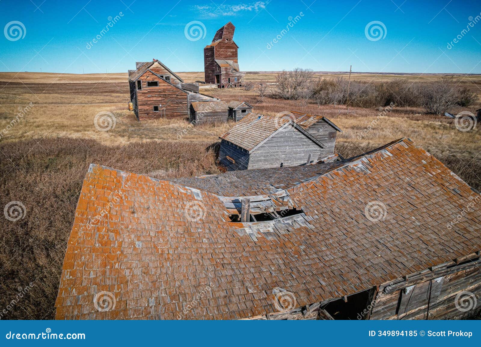A Desolate Landscape with a Few Old Buildings, Including a Grain ...