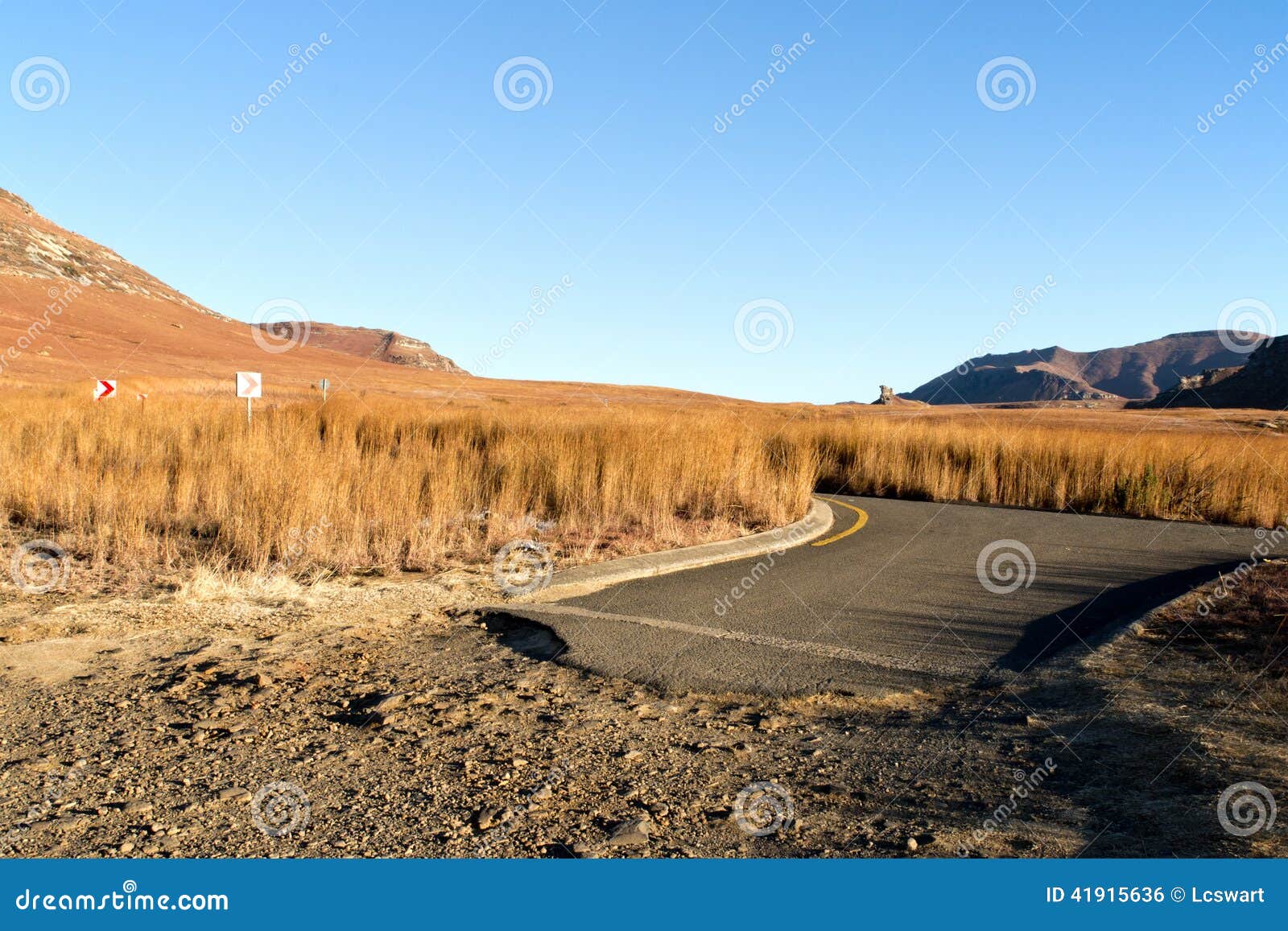 Desolate Rural Road Showing Where Asphalt Ends and Stock Photo - Image ...