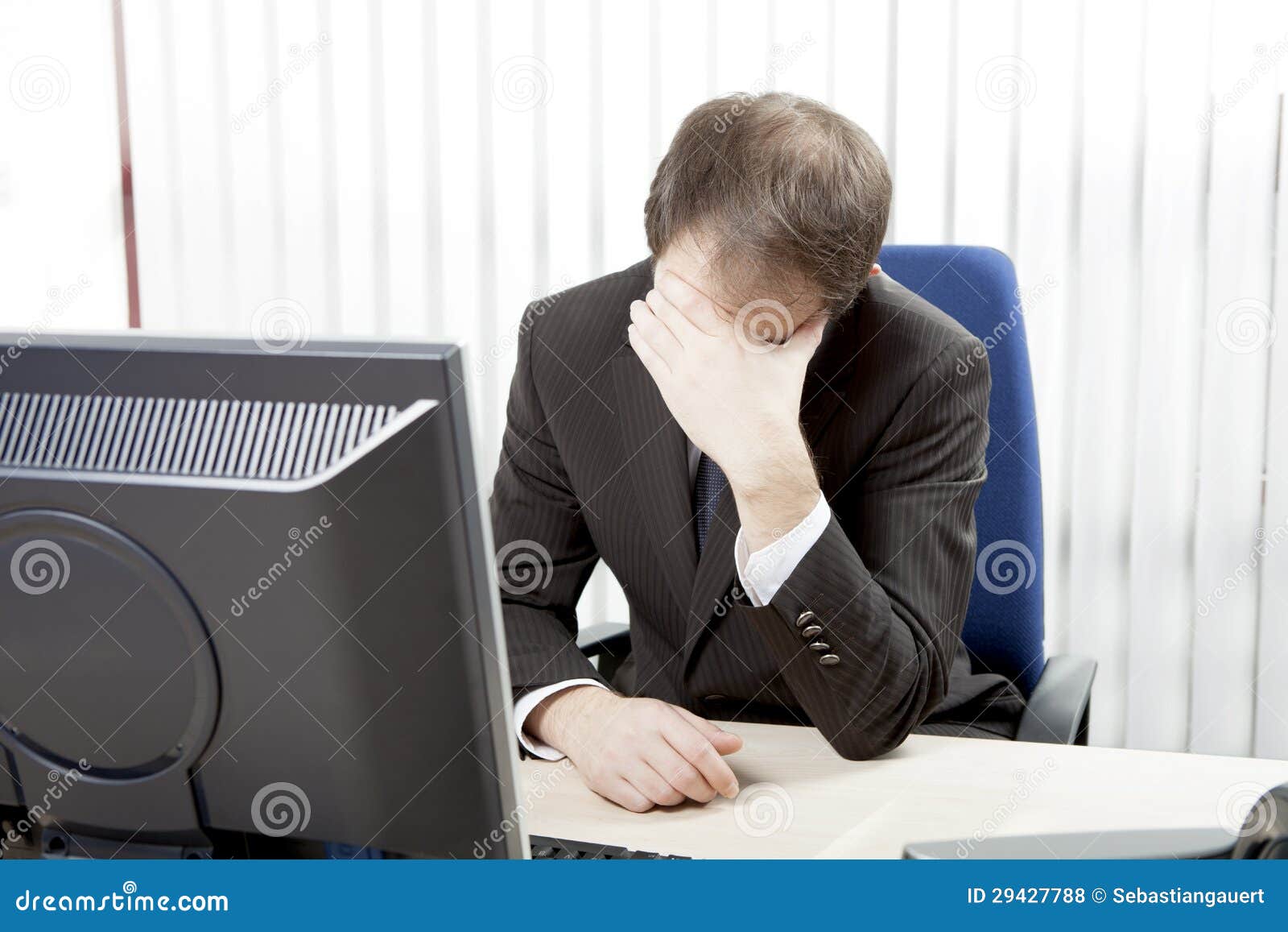 Despairing Businessman at His Desk Stock Photo - Image of employee ...