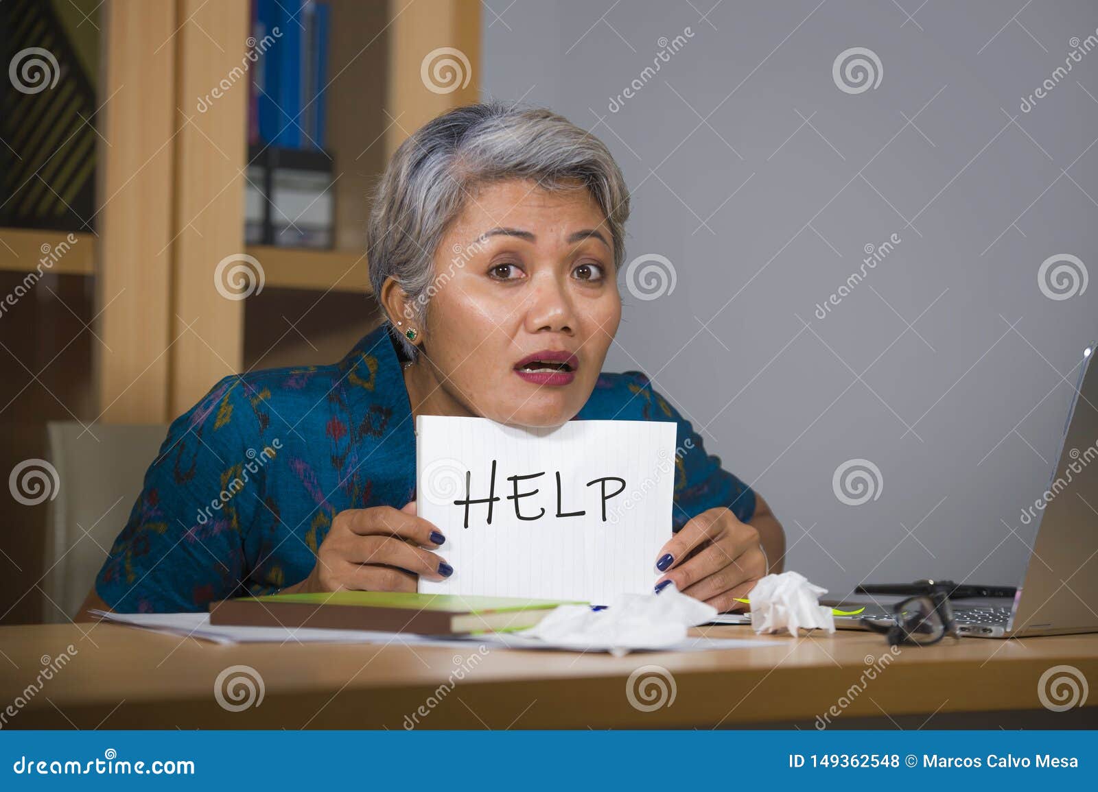 Desperate And Stressed Attractive Middle Aged Asian Woman Holding