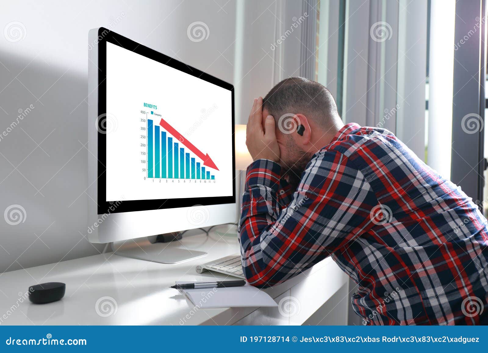 Desperate Young Man in Front of Computer with Bad Financial News on the ...