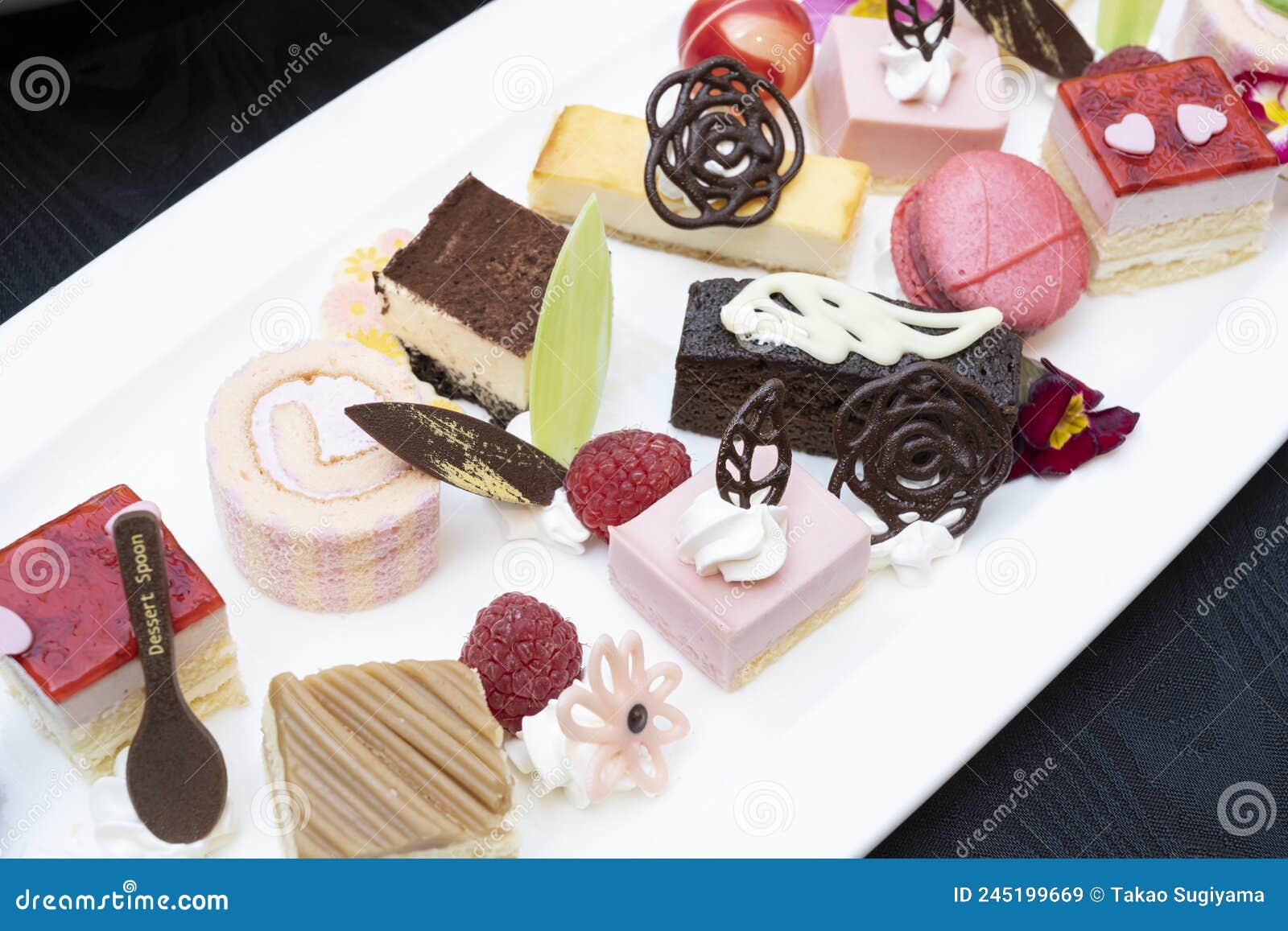 Cake Buffet with Various Bite-sized Cakes Lined Up Stock Image - Image ...