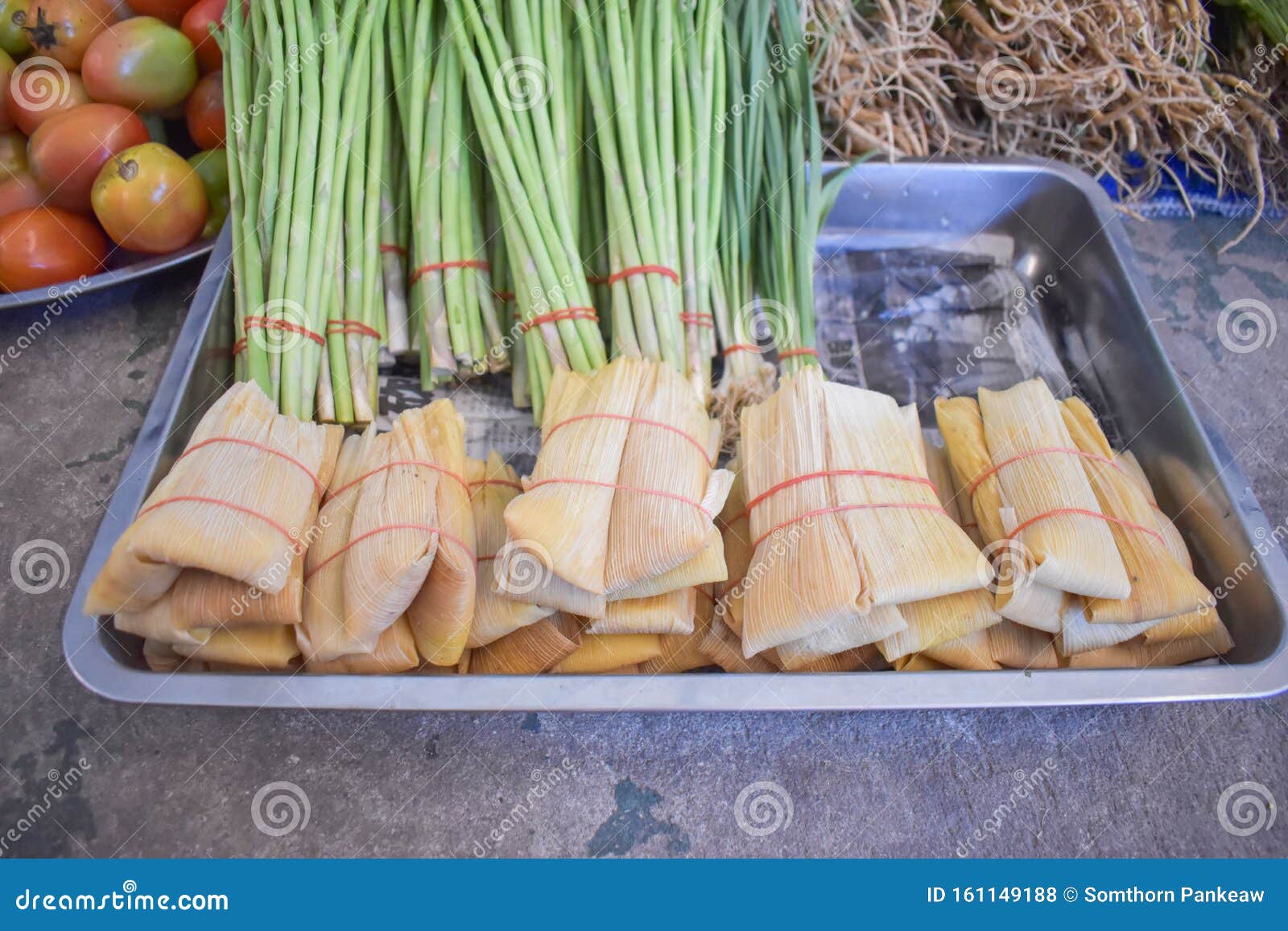 The Dessert is Made from Steamed Corn Wrapped in Corn Leaves Stock ...