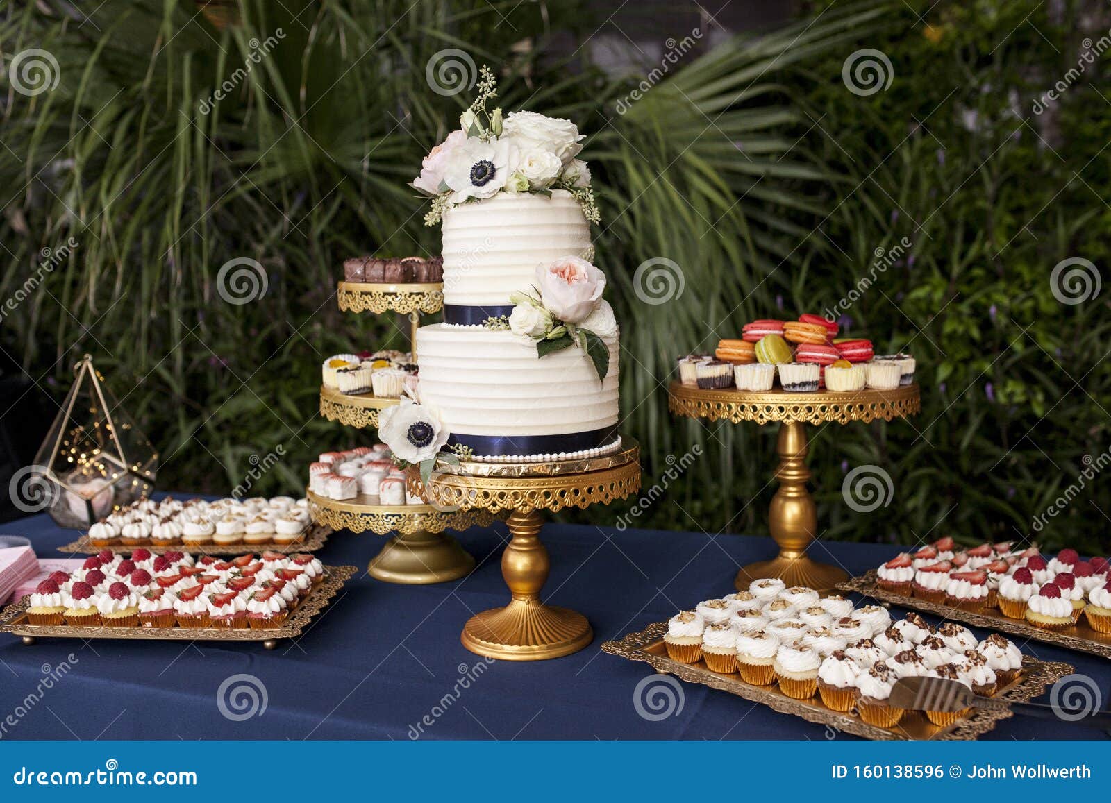 Dessert Table with Two Tiered Cake at Wedding Reception or Party Stock ...