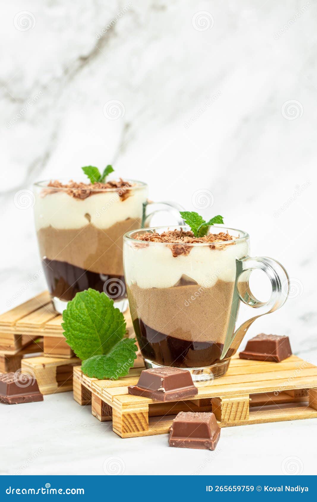 Dessert Three Chocolates Pudding Decorated with Mint on a Light ...