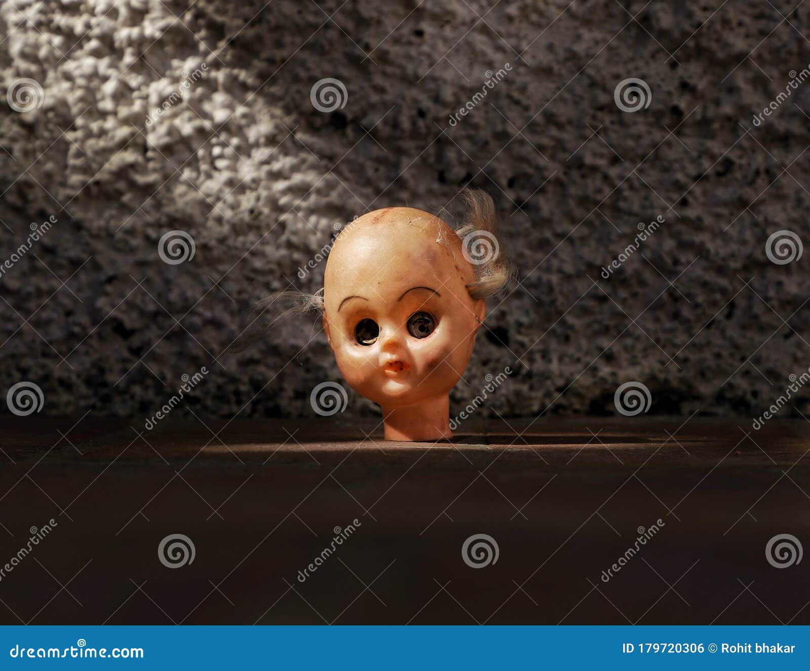 A Destroyed and Disturbing Broken Doll with Head Stock Photo - Image of ...