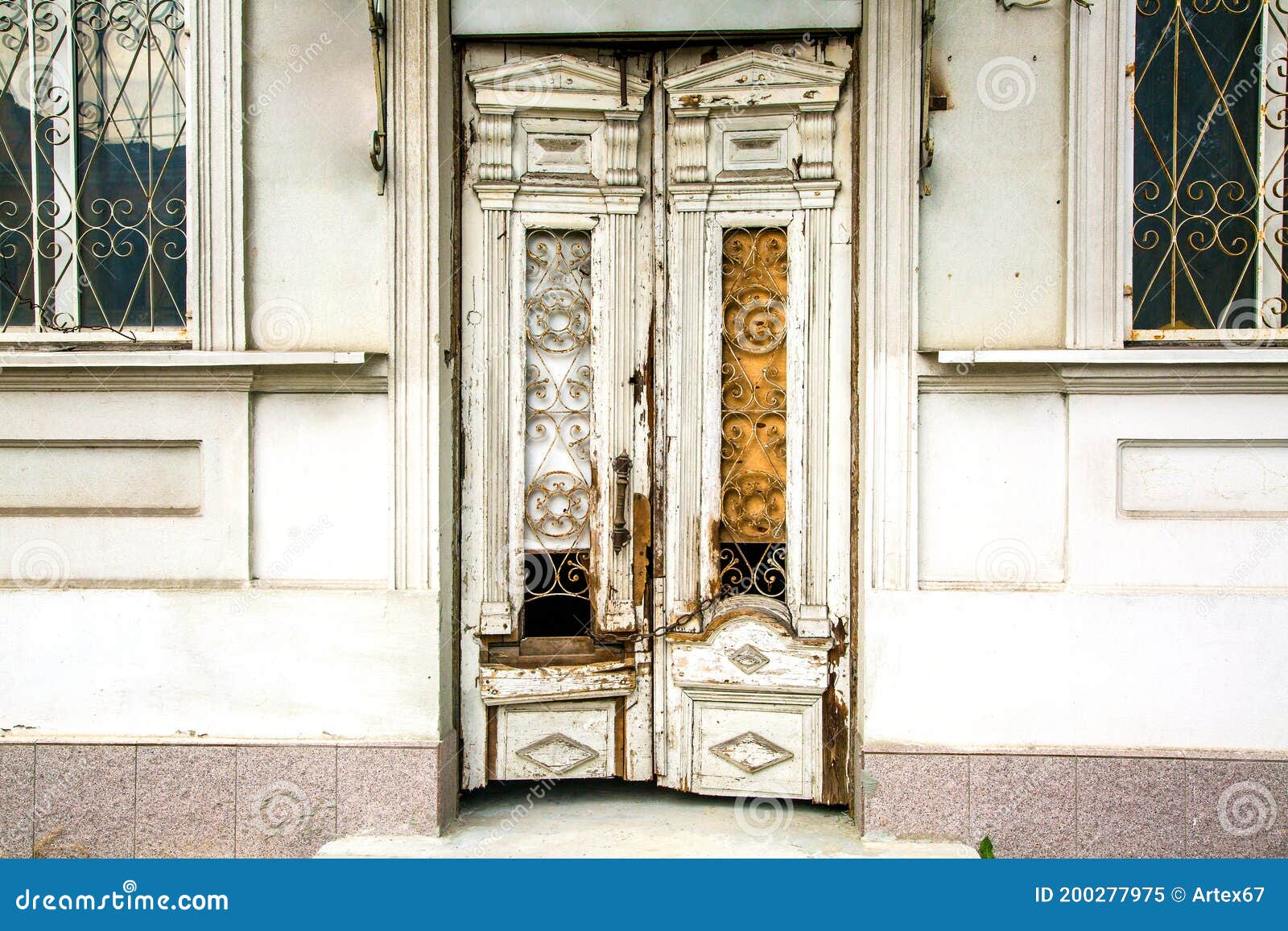 Destroyed Wooden Doors with Forged Inserts of an Old Mansion Stock ...