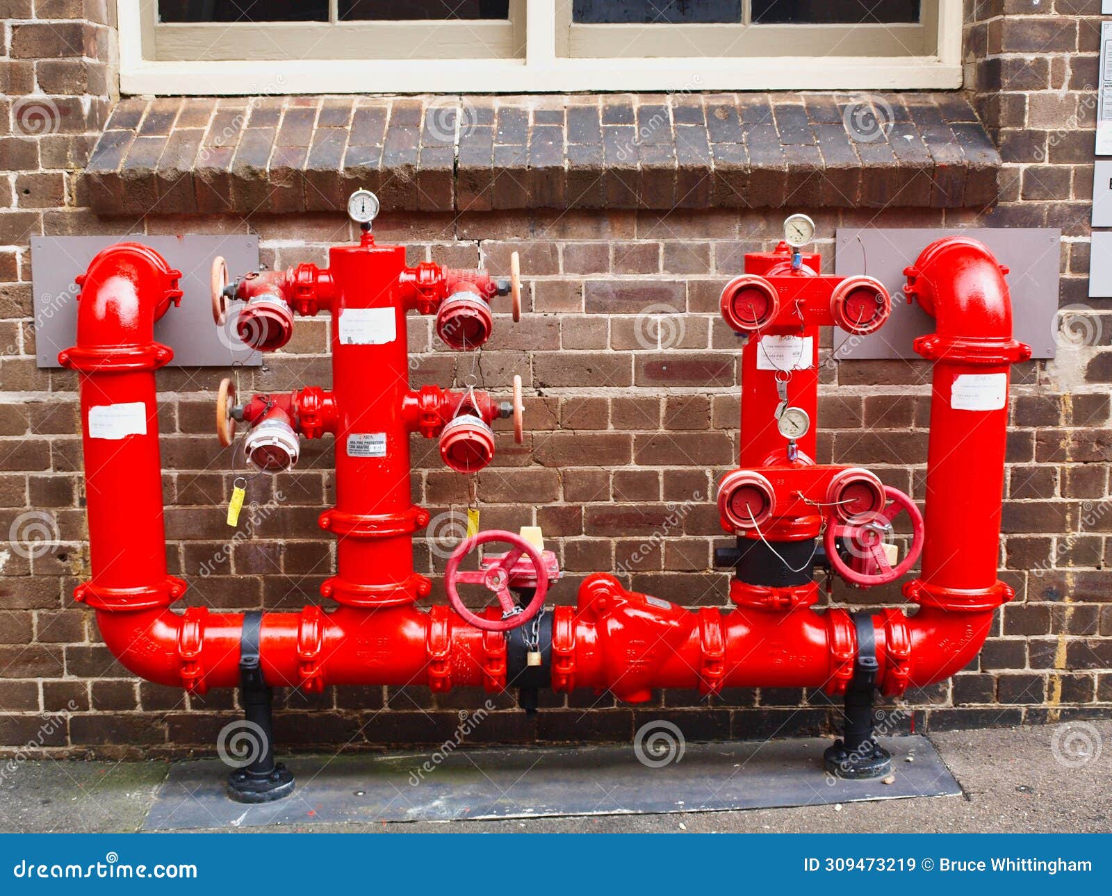 Bright Red Fire Hydrants on Brick Building Editorial Stock Image ...