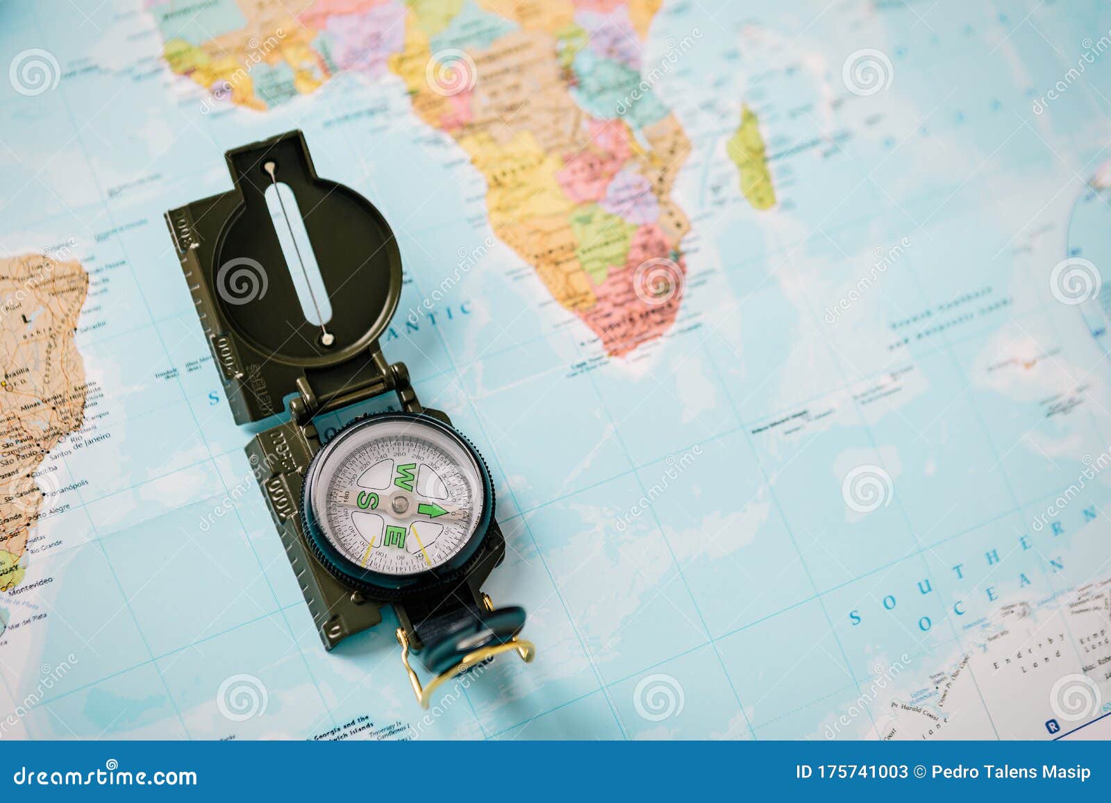 Detail of a Compass Camera on a World Map. Adventure Travel Concept ...