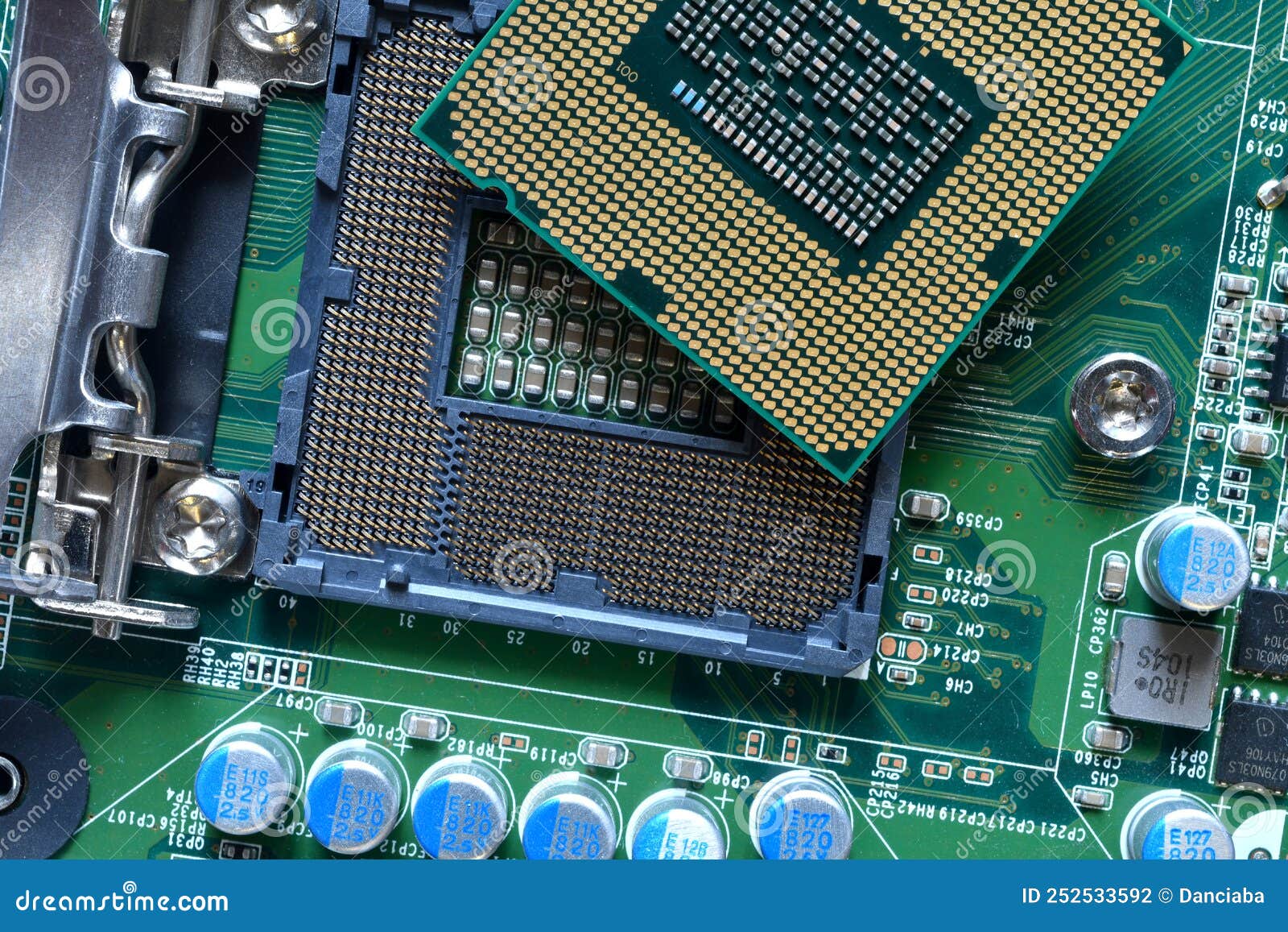 Detail of a CPU Processor Over His Socket on a Motherboard. Printed ...