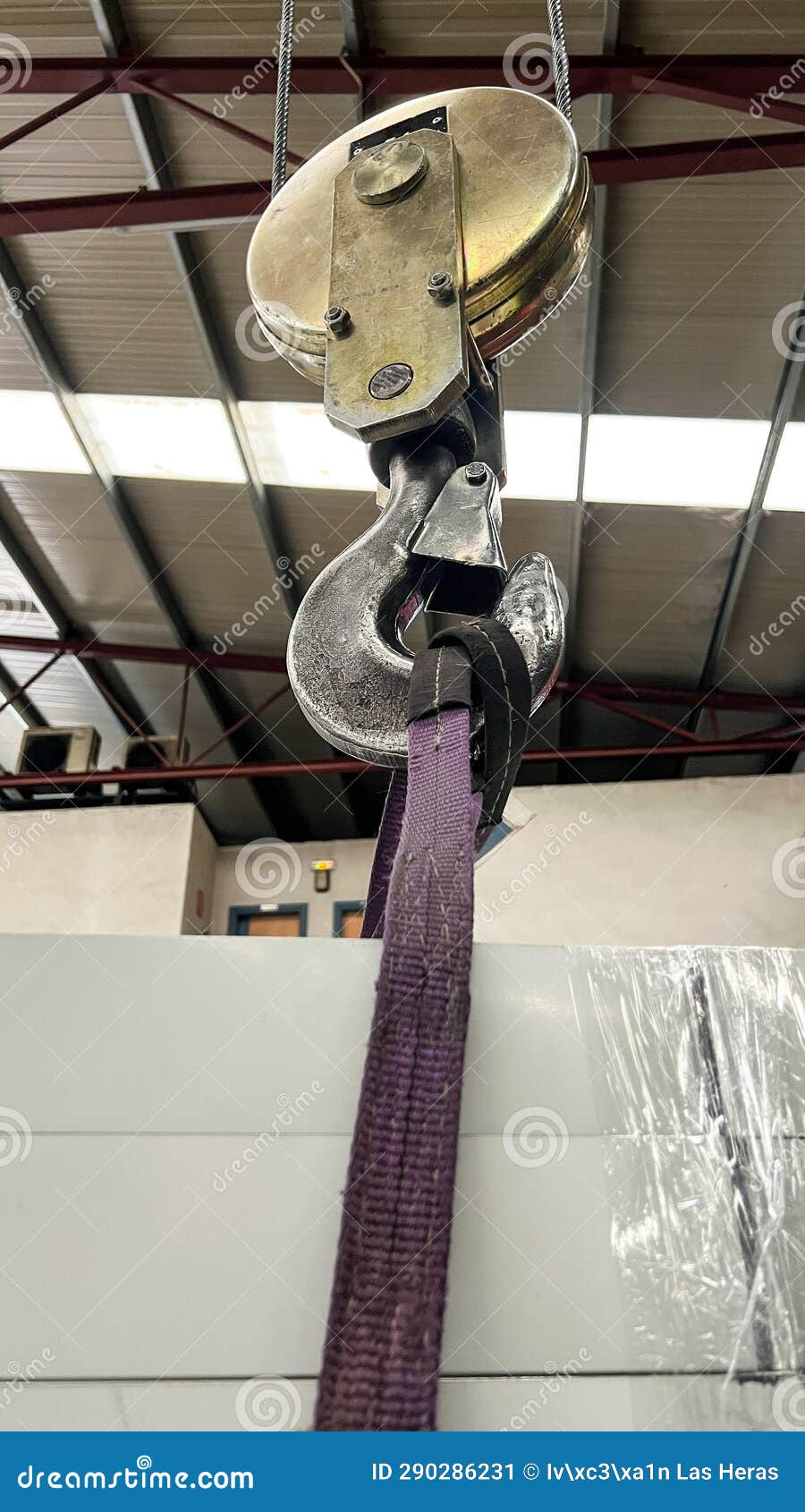 Detail of a Crane Picking Up and Lifting a Package in a Factory Stock ...