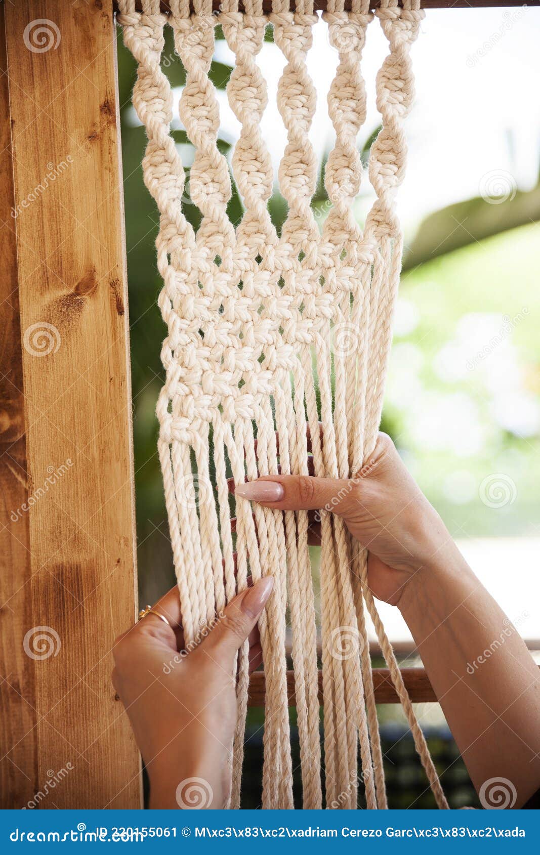 Detail of a Macrame Pattern and a Girl`s Hands Holding the Strings ...