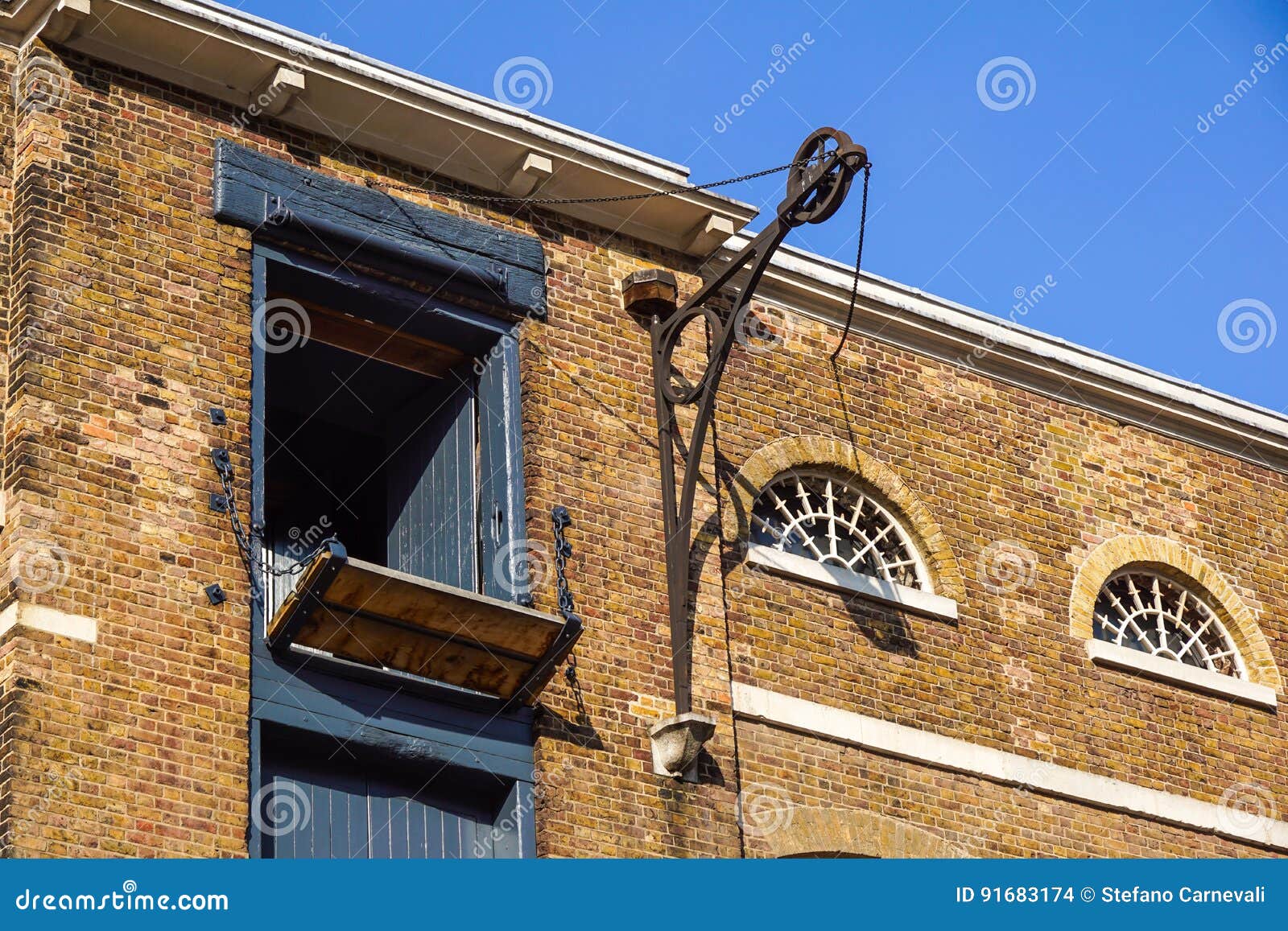 Detail of Old Brick Building in England with Loading Doors Stock Photo ...