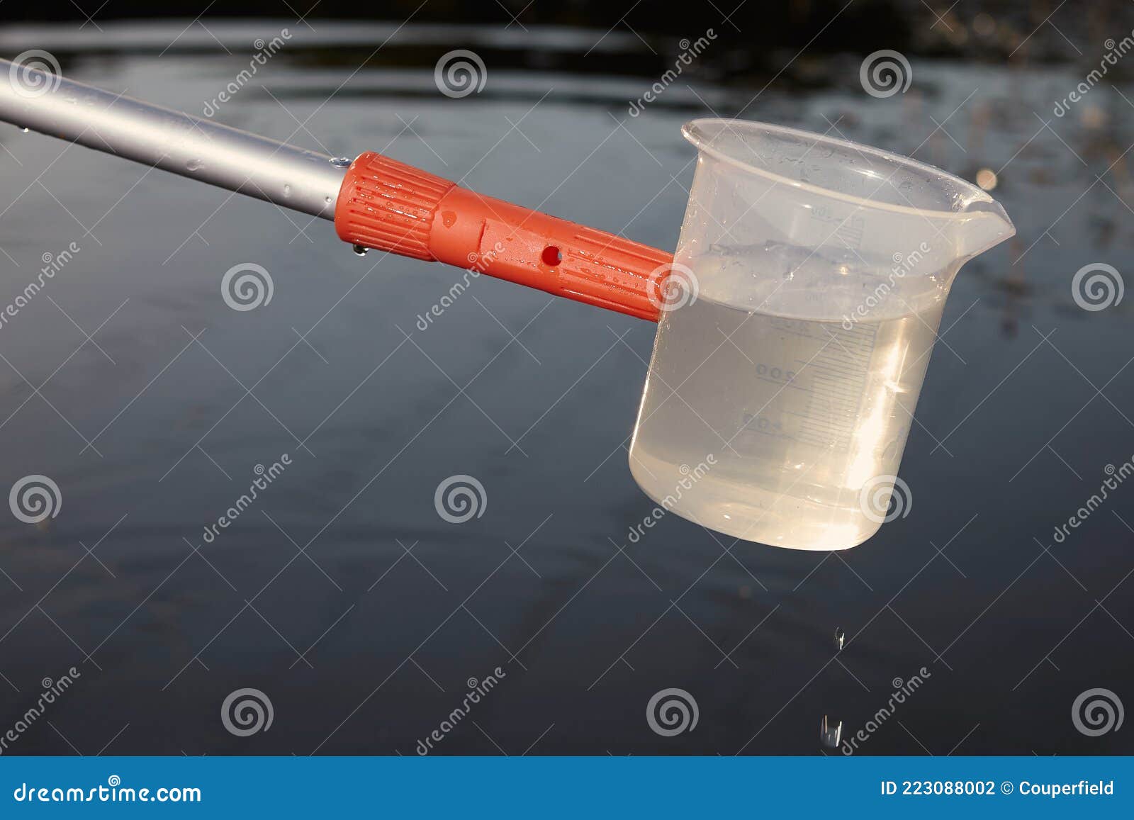Detail of Plastic Sampling Beaker on Rod with Sample of Water Stock ...