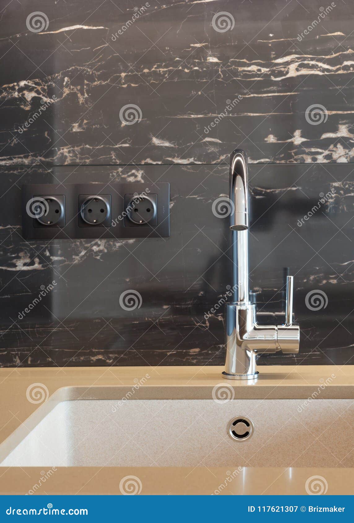 Detail of a Rectangular Designer Kitchen Sink with Chrome Water Tap ...