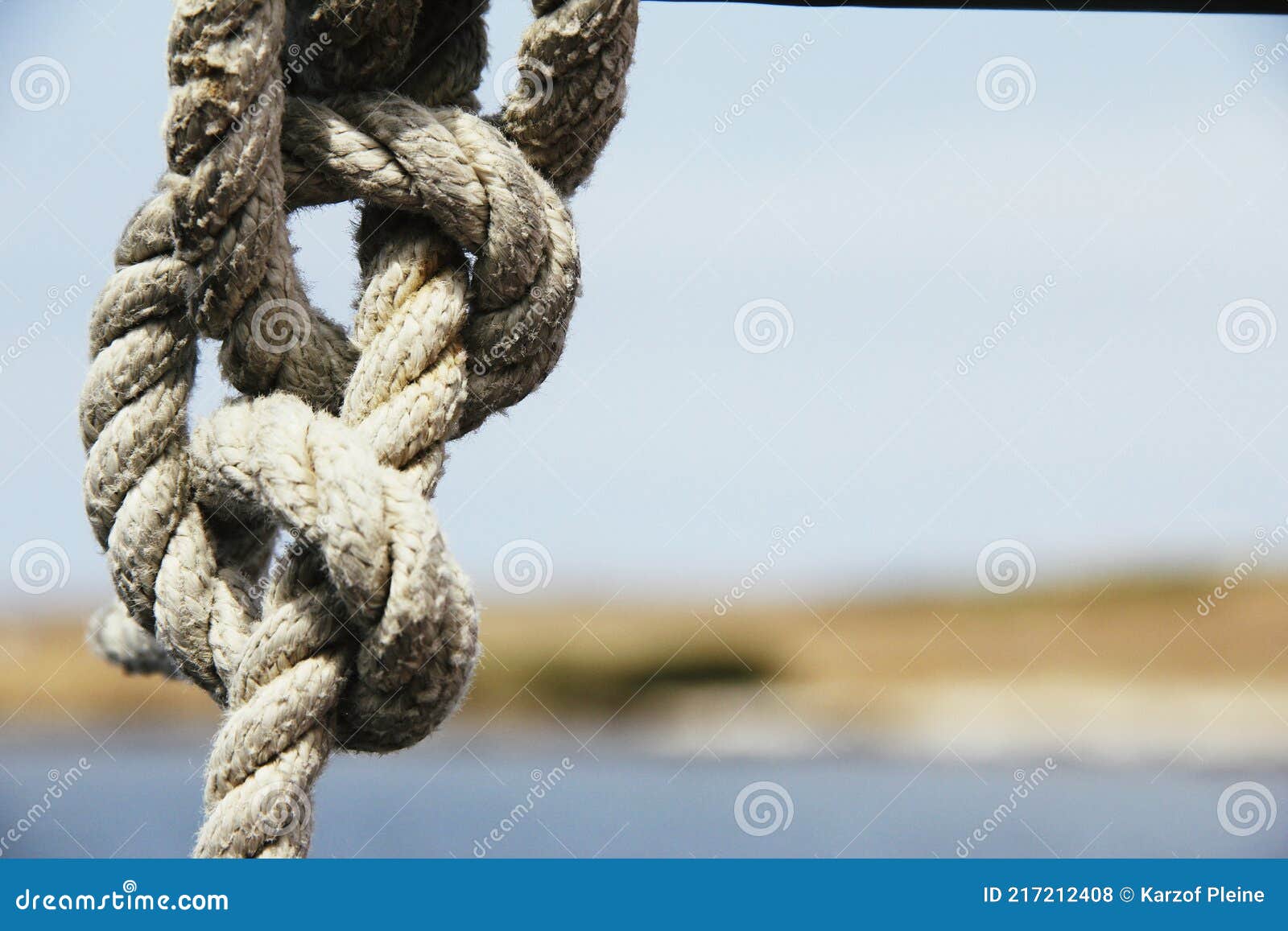 Detail of Rope Knot with Sea on the Bottom Stock Photo - Image of ...