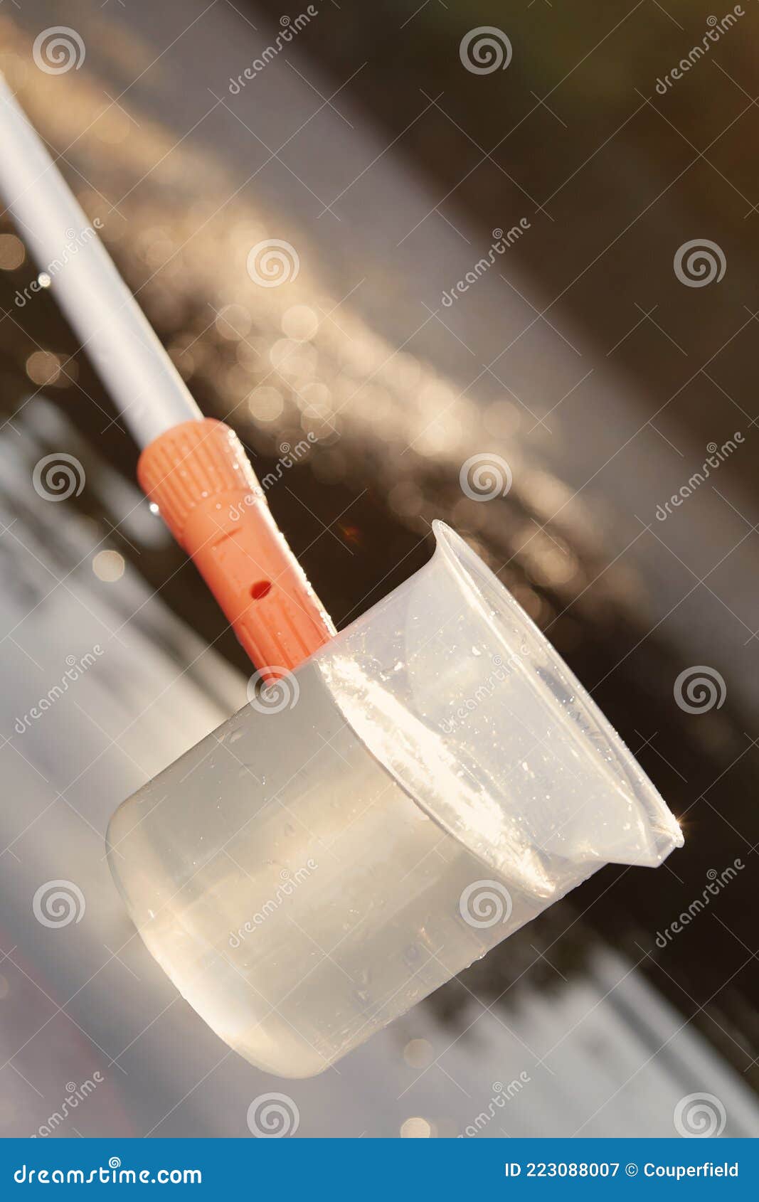 Detail of Plastic Sampling Beaker on Rod with Sample of Water Stock ...