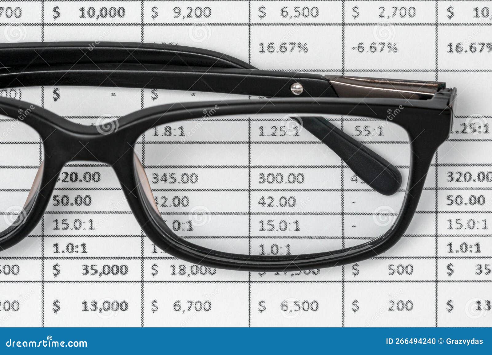 Detail of a Spreadsheet and Glasses on the Table in the Office Stock ...