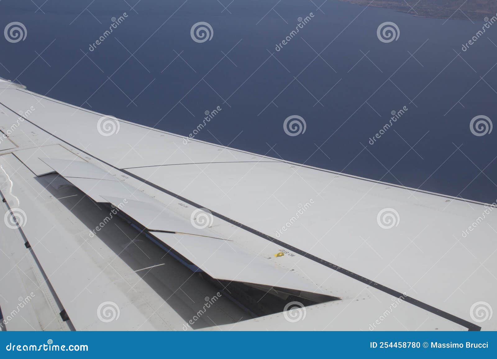 Detail of the Wing of an Airplane with Flaps in Motion Stock Photo ...