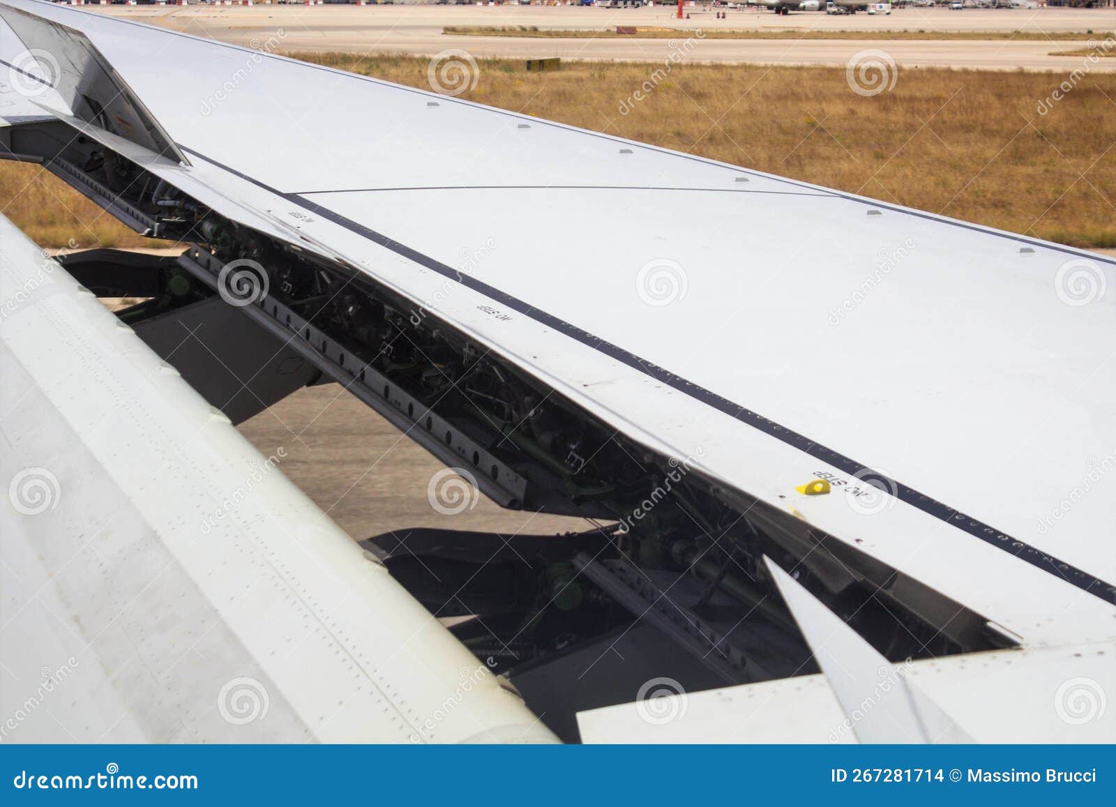 Detail of the Wing of an Airplane with Flaps in Motion Stock Photo ...