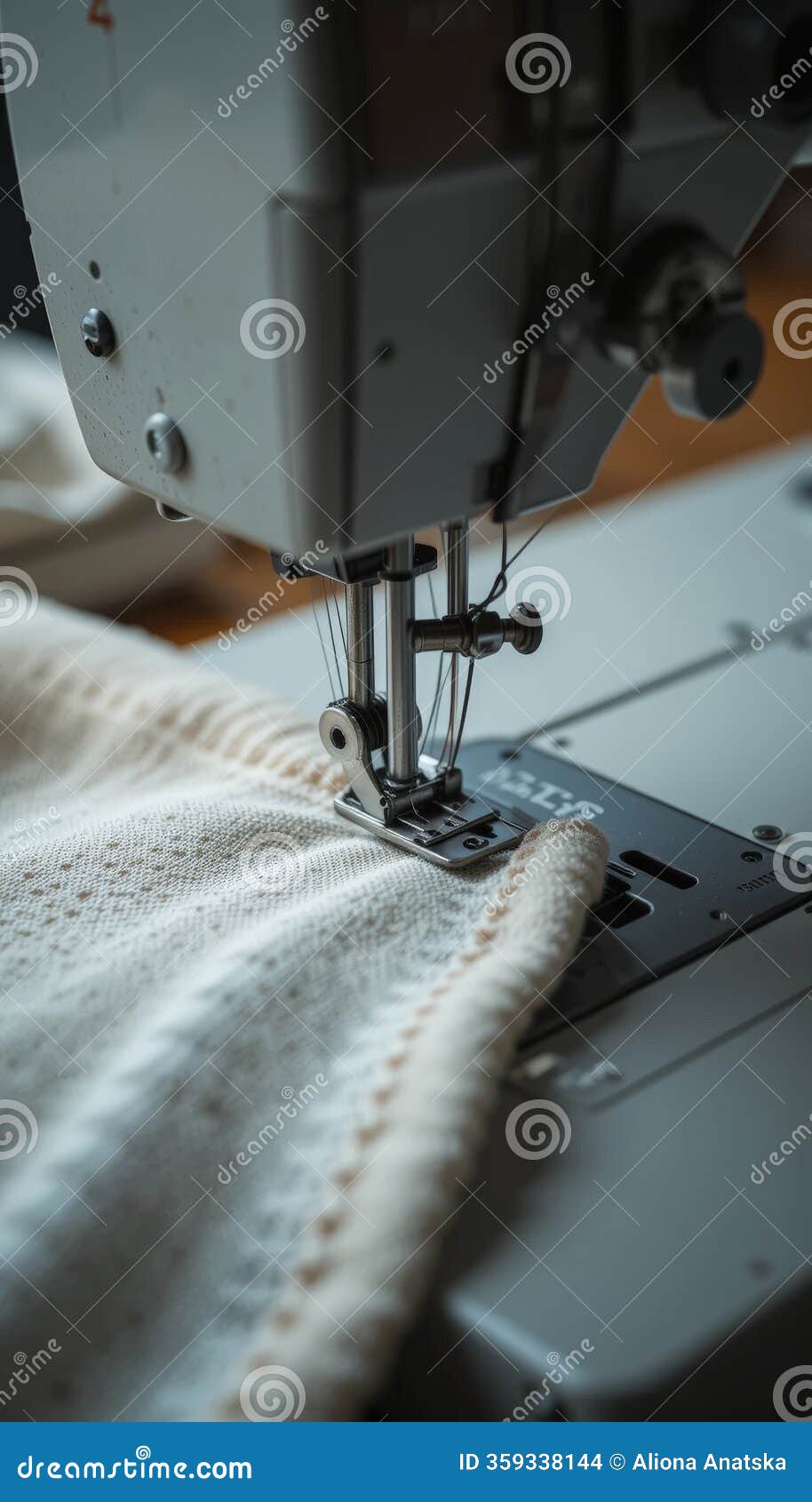 A Detailed Close-up of a Sewing Machine Threading Fabric, Capturing the ...
