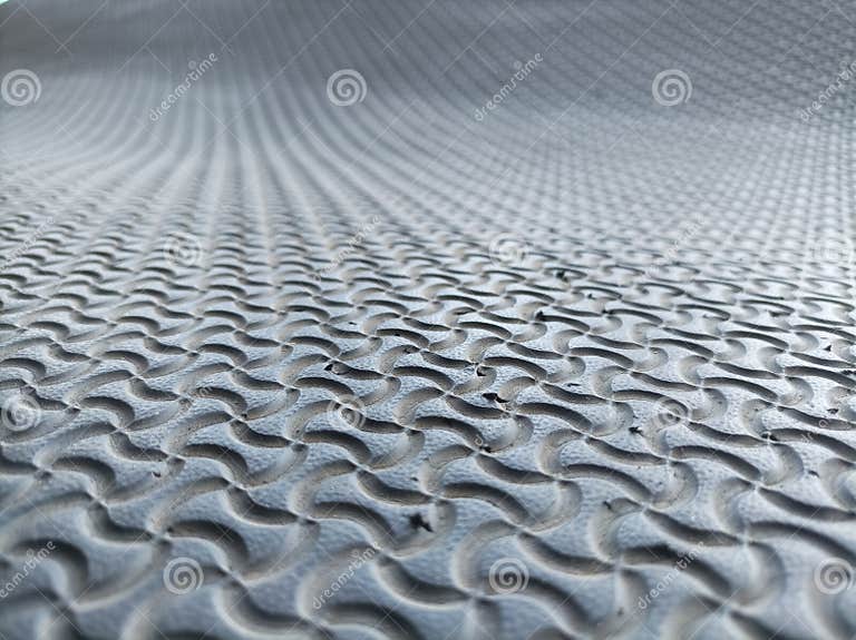 Close-up of a Textured Rubber Mat with a Wave-like Pattern, Creating a ...