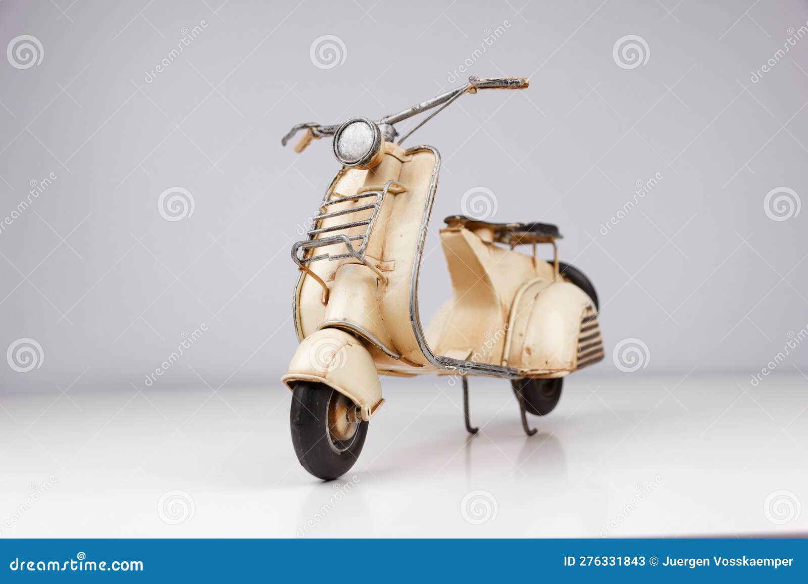 Detailed View of Motor Scooter Model on White Table Stock Image - Image ...
