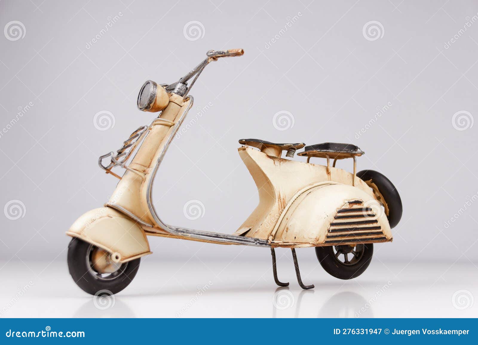 Detailed View of Motor Scooter Model on White Table Stock Image - Image ...