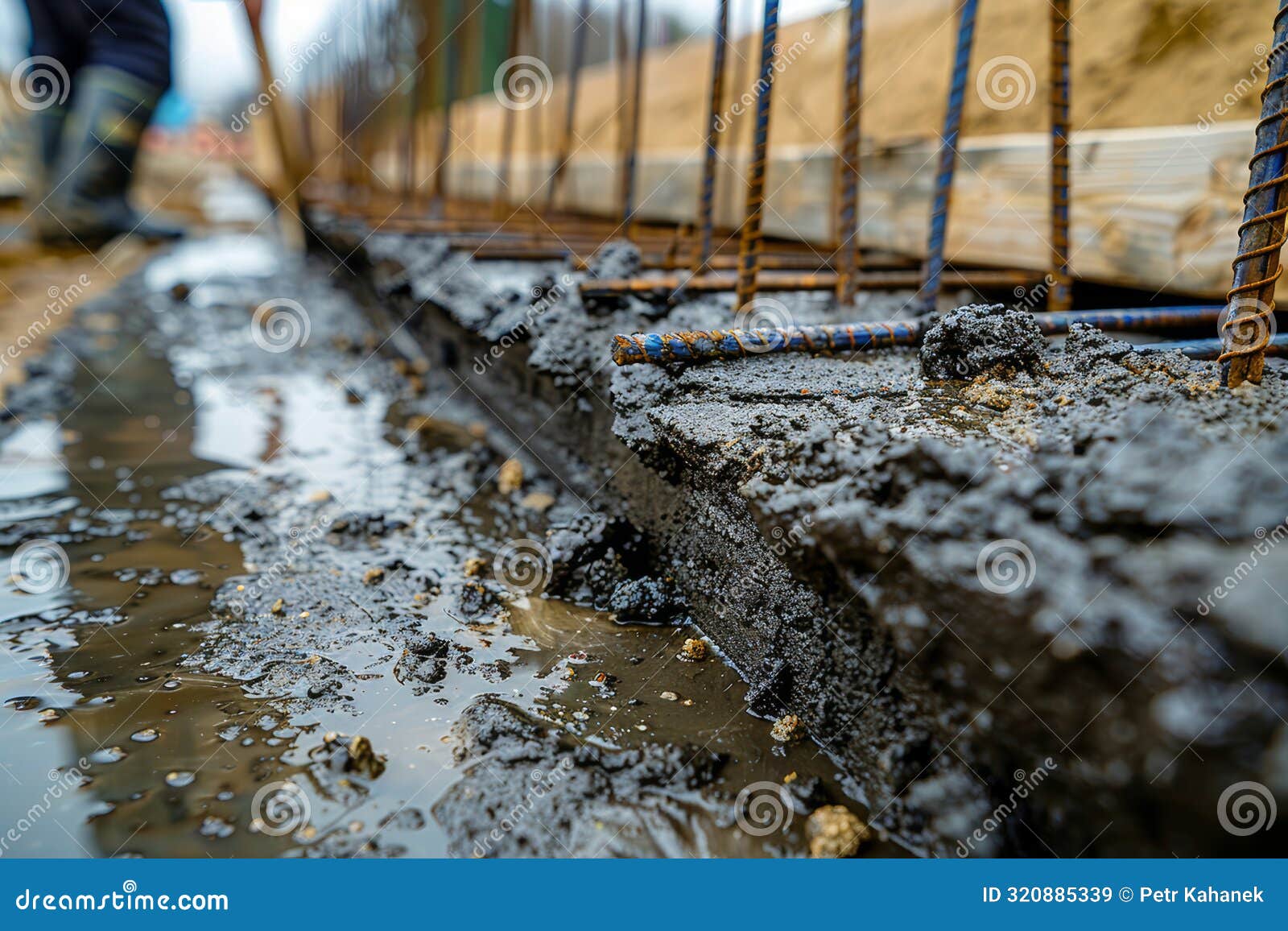 Detailed View of Wet Concrete Being Spread on a Rebar Framework ...