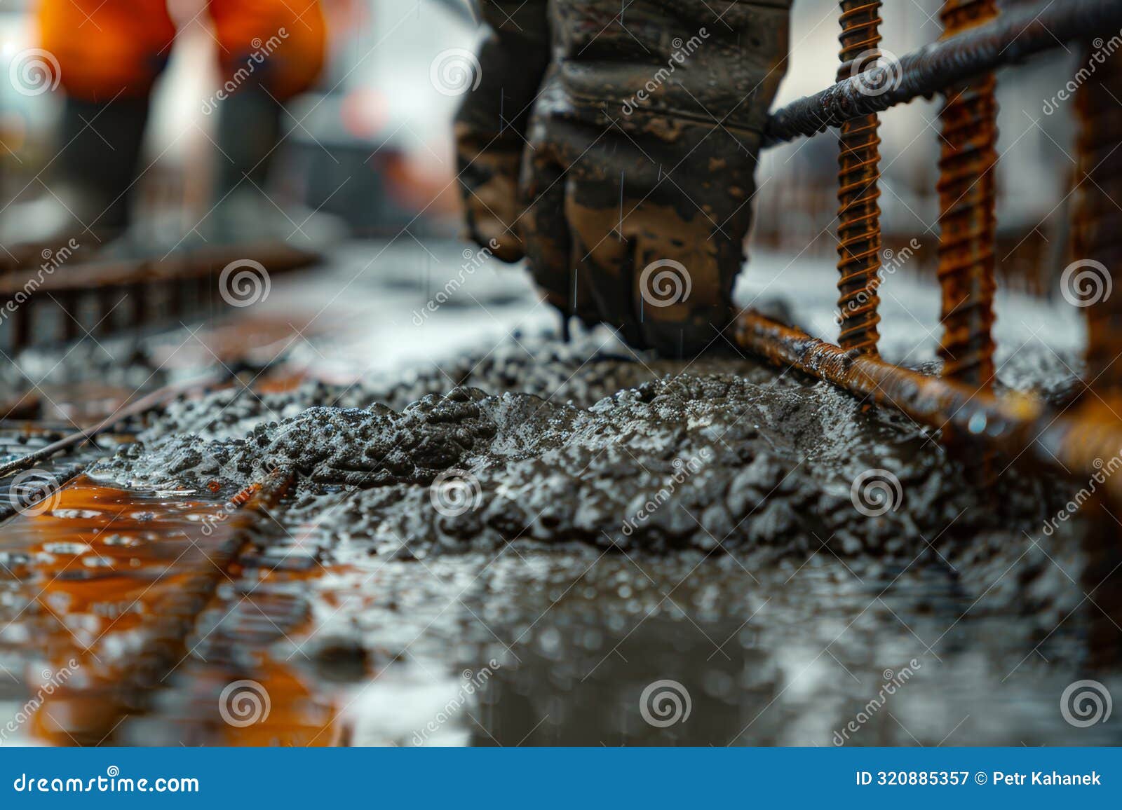 Detailed View of Wet Concrete Being Spread on a Rebar Framework ...