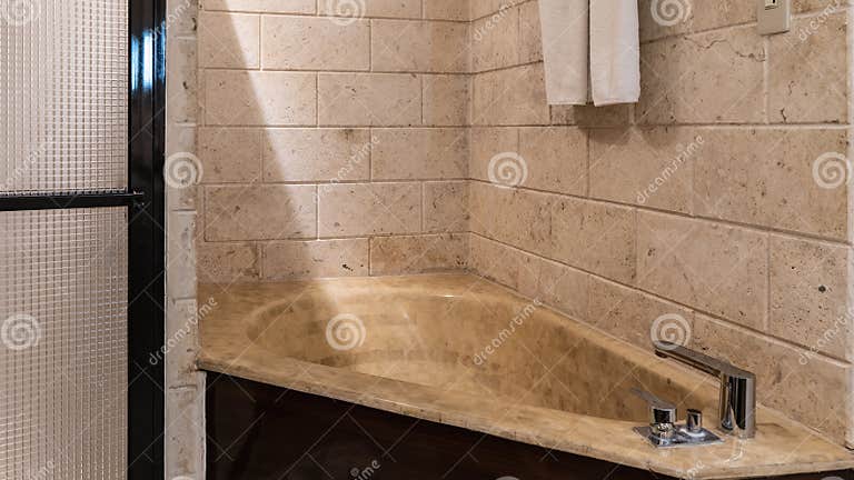 Details of the Bathroom Interior. a Beige Triangular Bathtub Stock ...