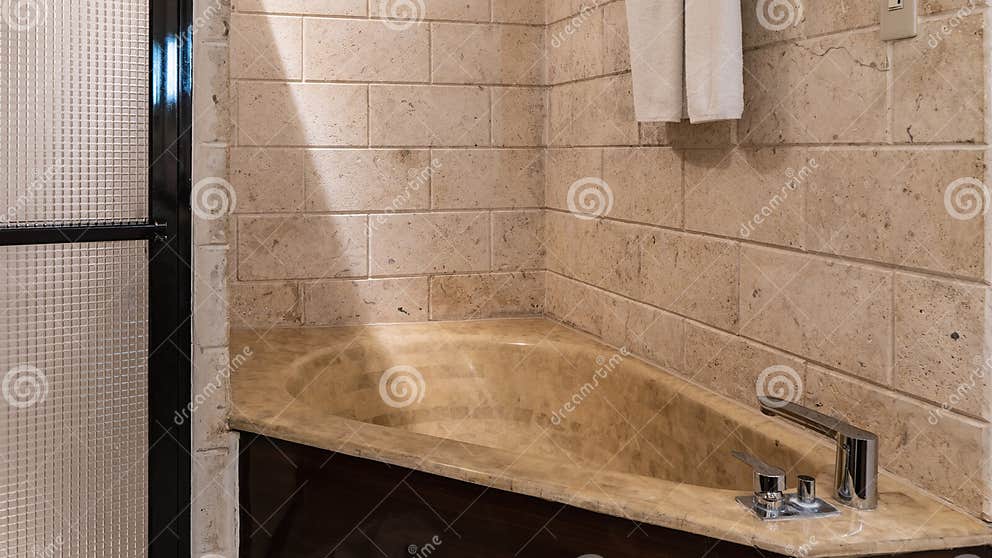 Details of the Bathroom Interior. a Beige Triangular Bathtub Stock ...