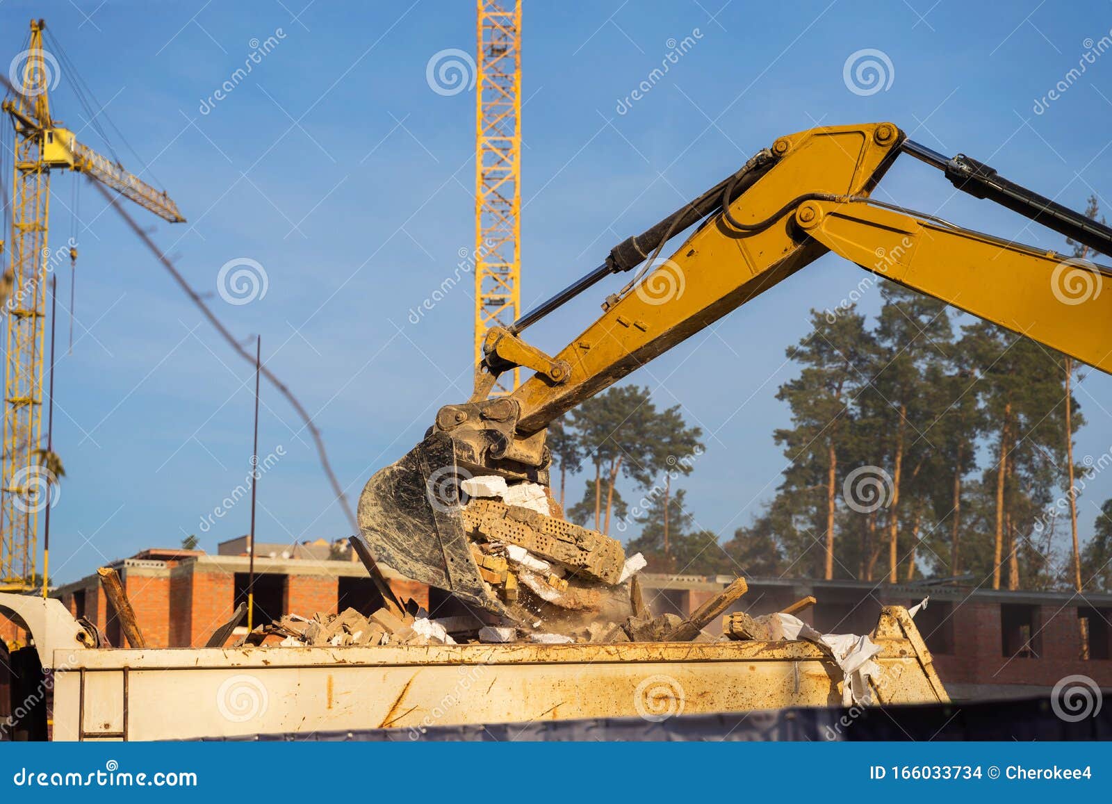 Details of Excavator Scoop Destroying and Loading Debris into a Dump ...