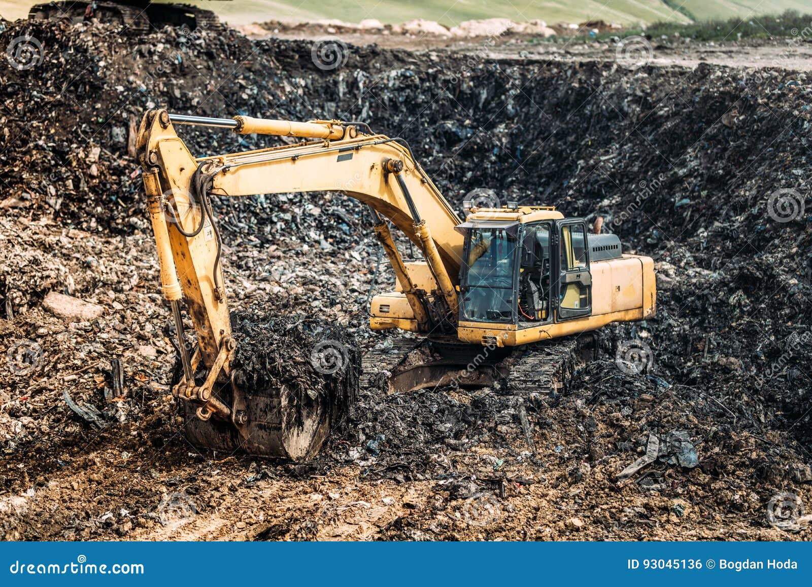 Details of Garbage Dump. Heavy Duty Excavator Digging and Loading Urban ...