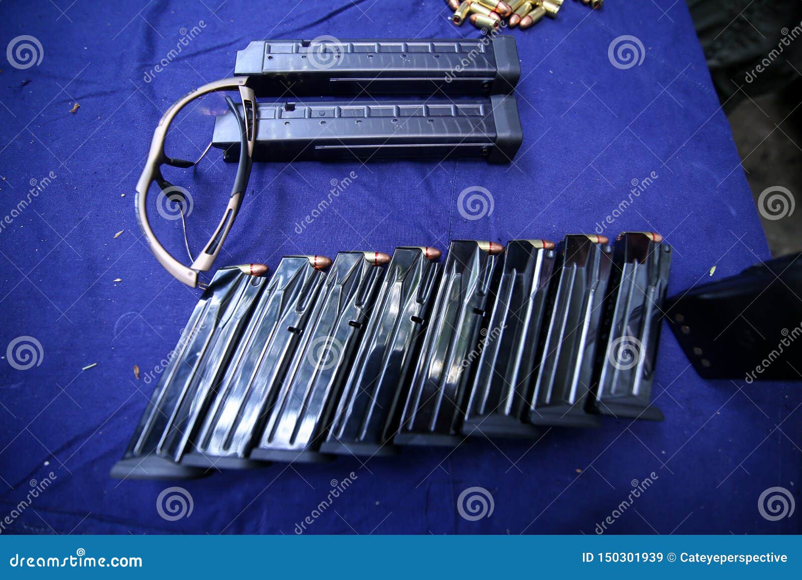 Details with Gun Clips, 9mm Ammunition and Protective Glasses on a ...