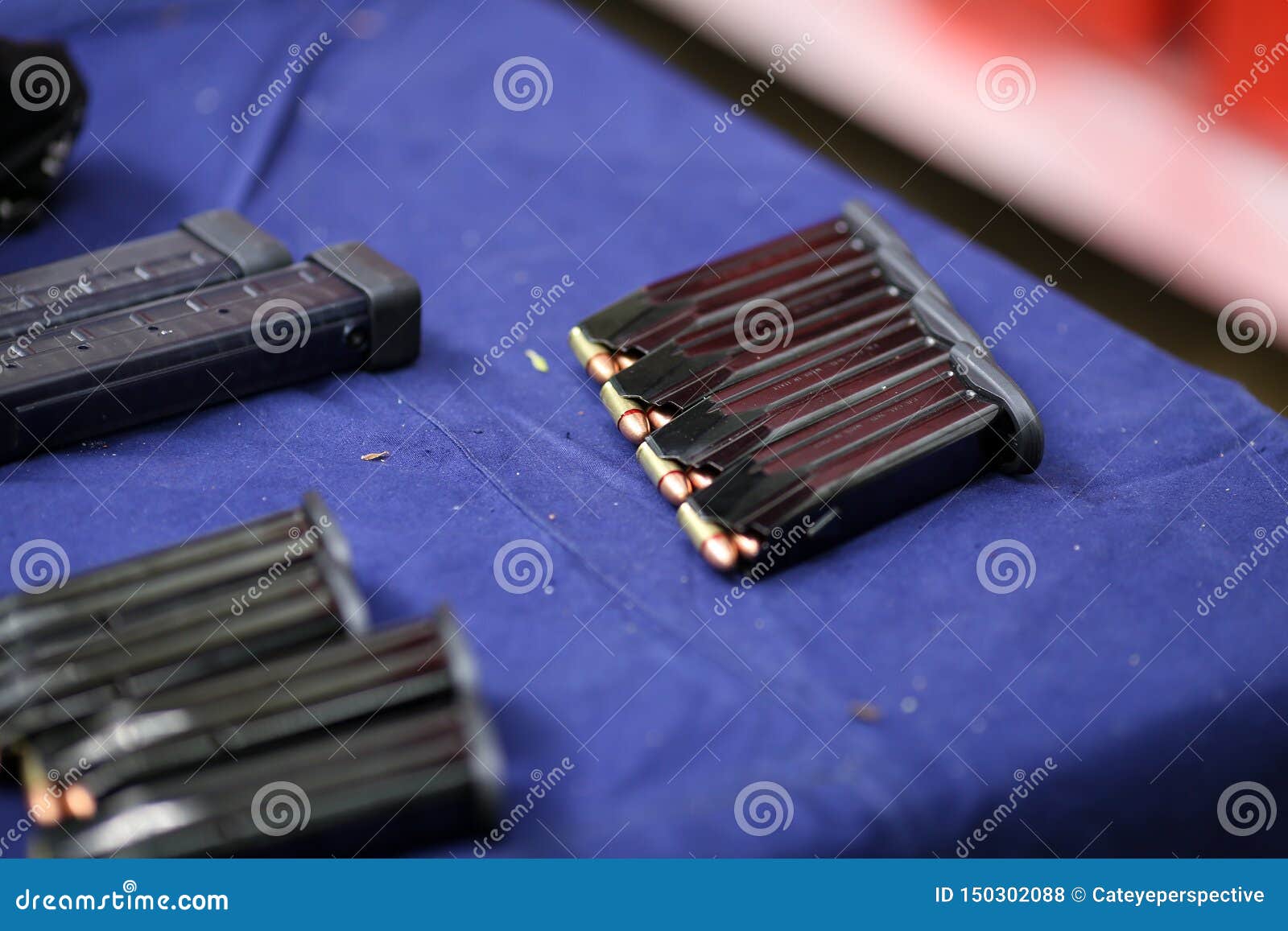 Details with Gun Clips and 9mm Ammunition on a Table on a Shooting ...