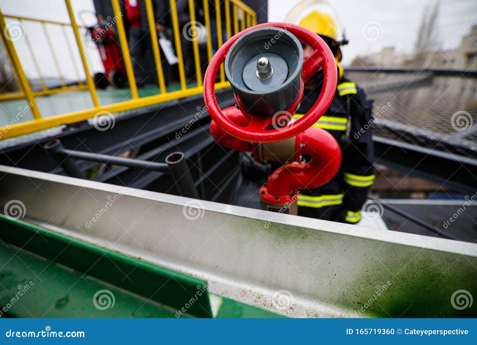Details with the Hands of a Firefighter Holding a Fire Suppression ...