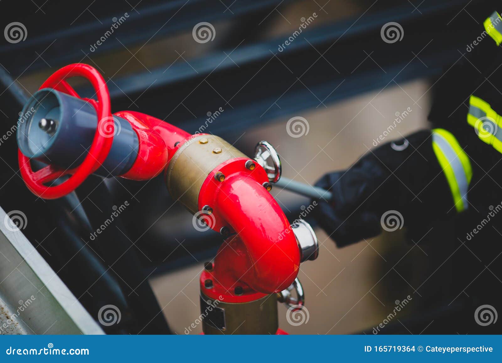Details with the Hands of a Firefighter Holding a Fire Suppression ...